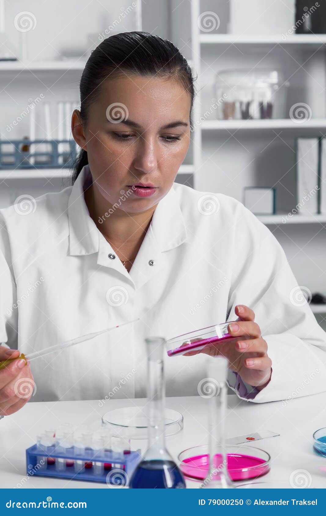 Young Female Scientist Analyzing Sample in Laboratory.laboratory ...