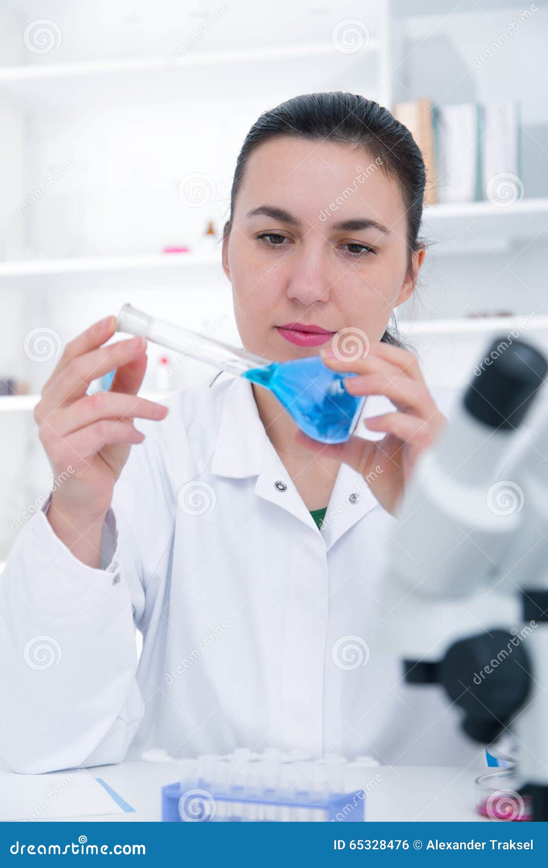 Young Female Scientist Analyzing Sample in Laboratory.laboratory ...