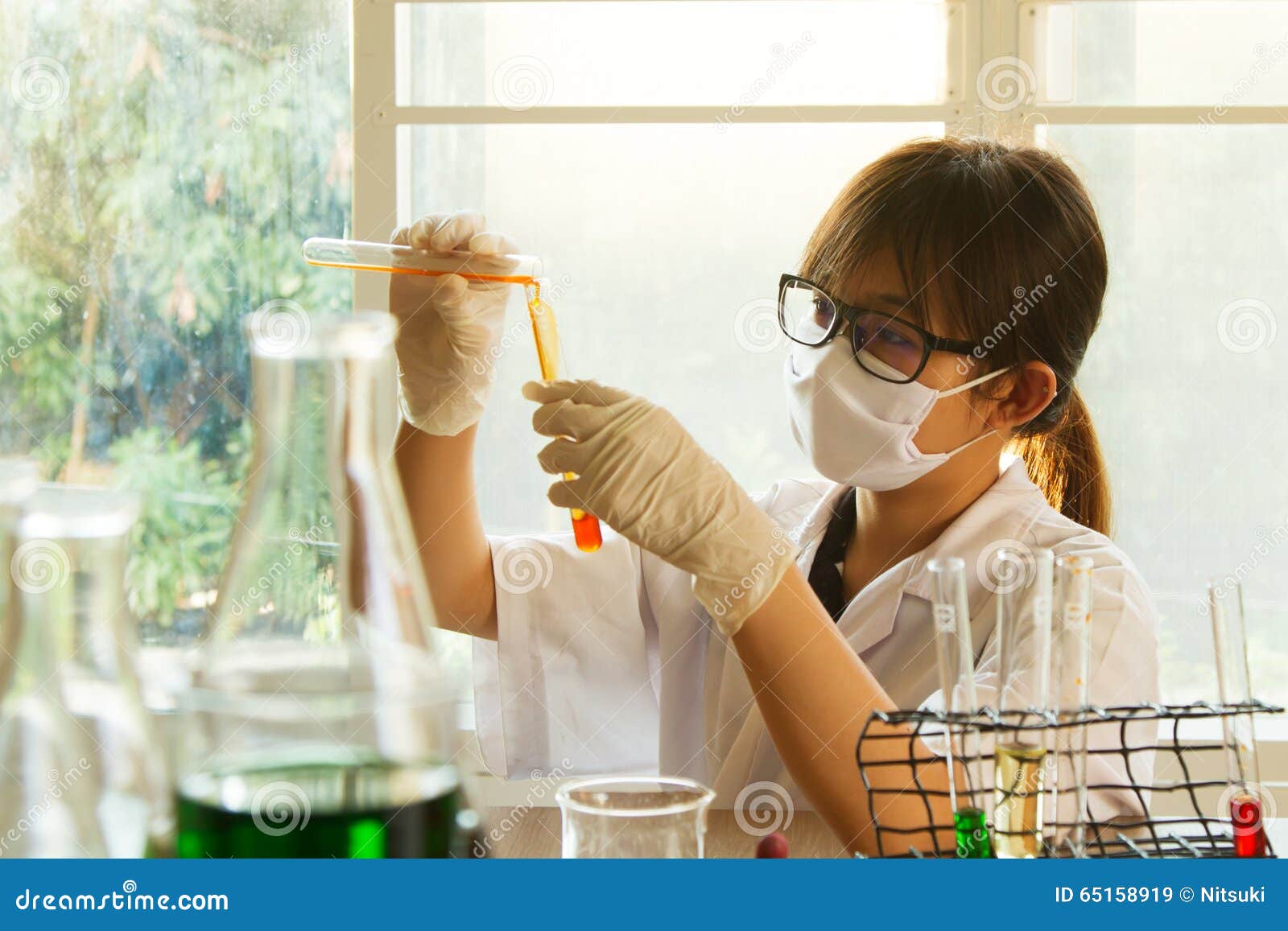 Young Female Scientist Mixing Chemical Stock Image - Image of ...