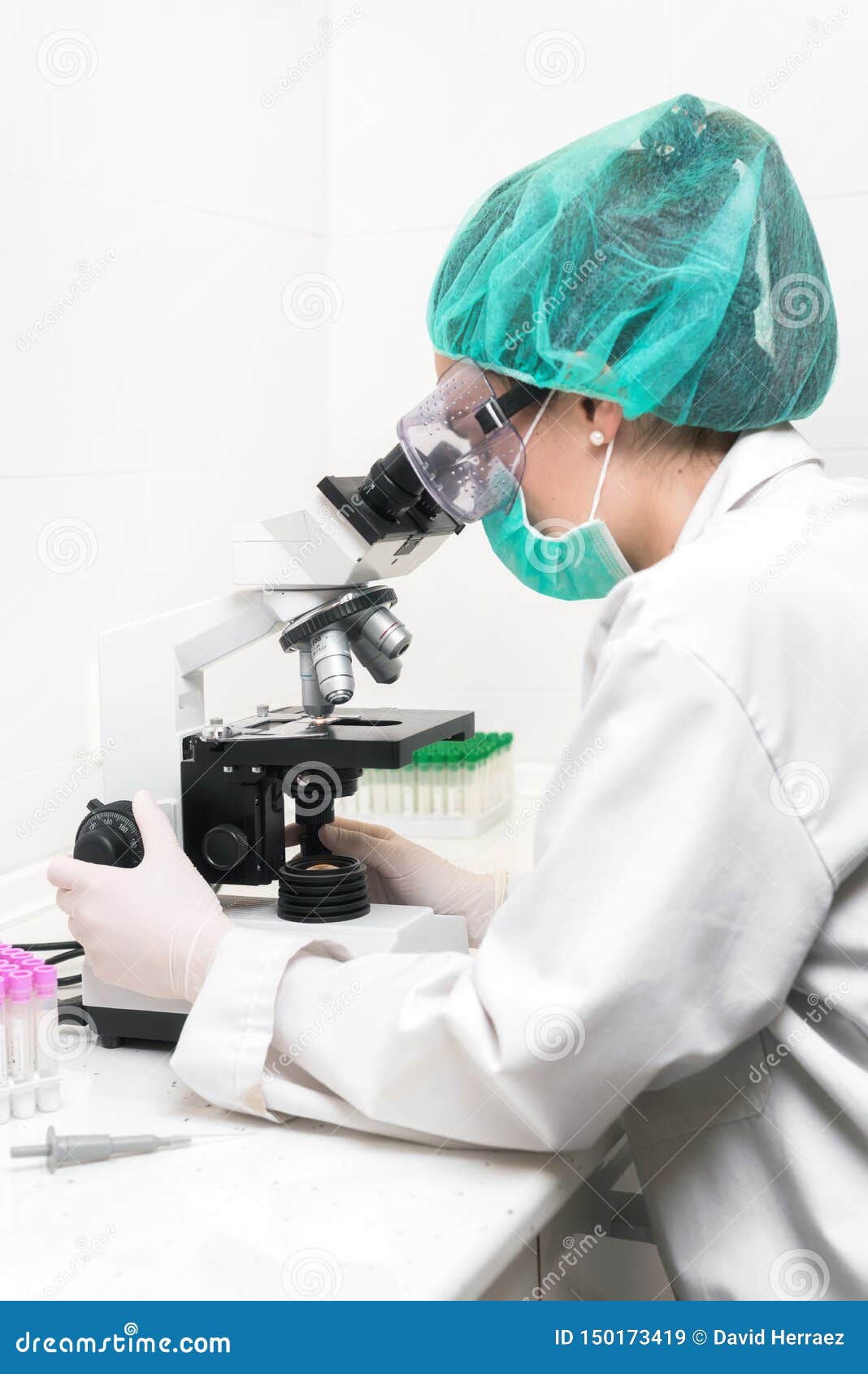 Young Female Scientist in Modern Laboratory, Using Microscope. Stock ...
