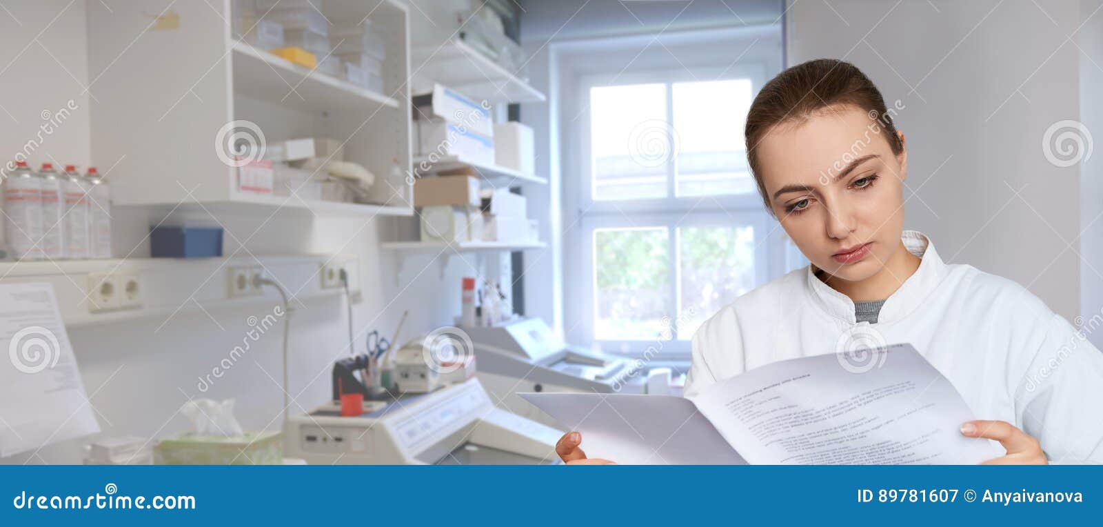 Young Female Scientist Reading Printed Notes in Scientific Labo Stock ...