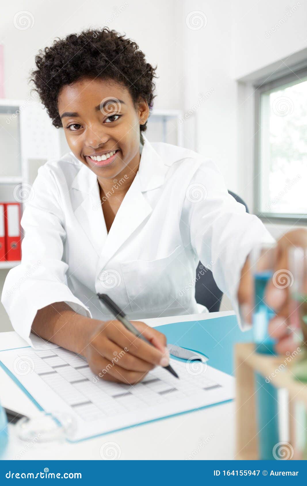 Young Female Scientist Taking Notes at Modern Lab Stock Image - Image ...