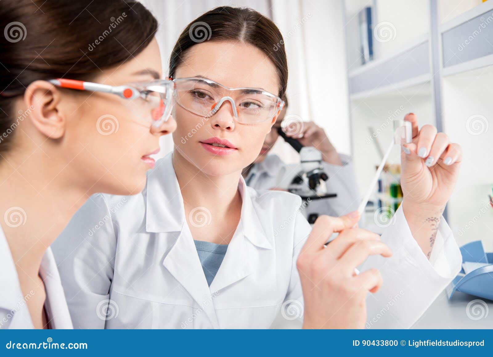 Young female scientists stock photo. Image of scientists - 90433800