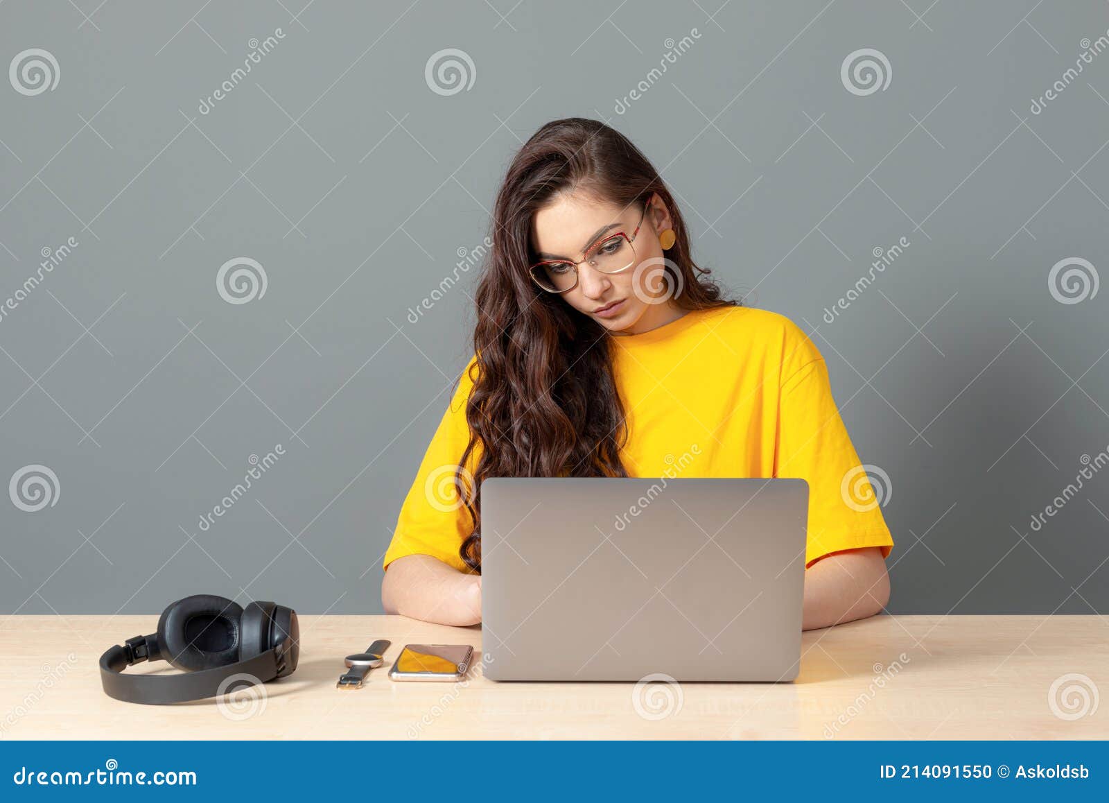 Young Female Student Sitting at the Table, Using Laptop when Studying ...