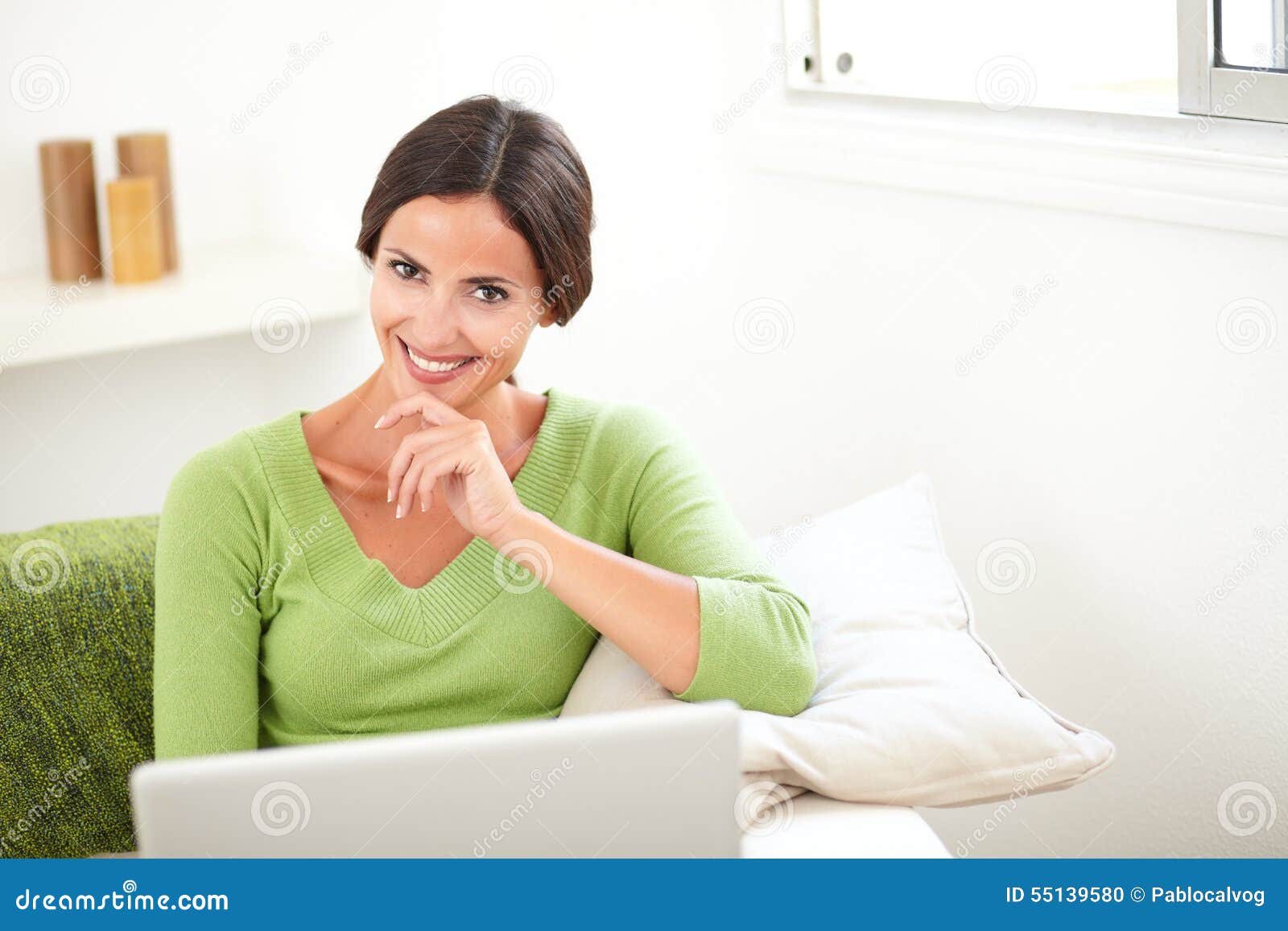 Young Female Smiling while Using a Laptop Stock Photo - Image of ...