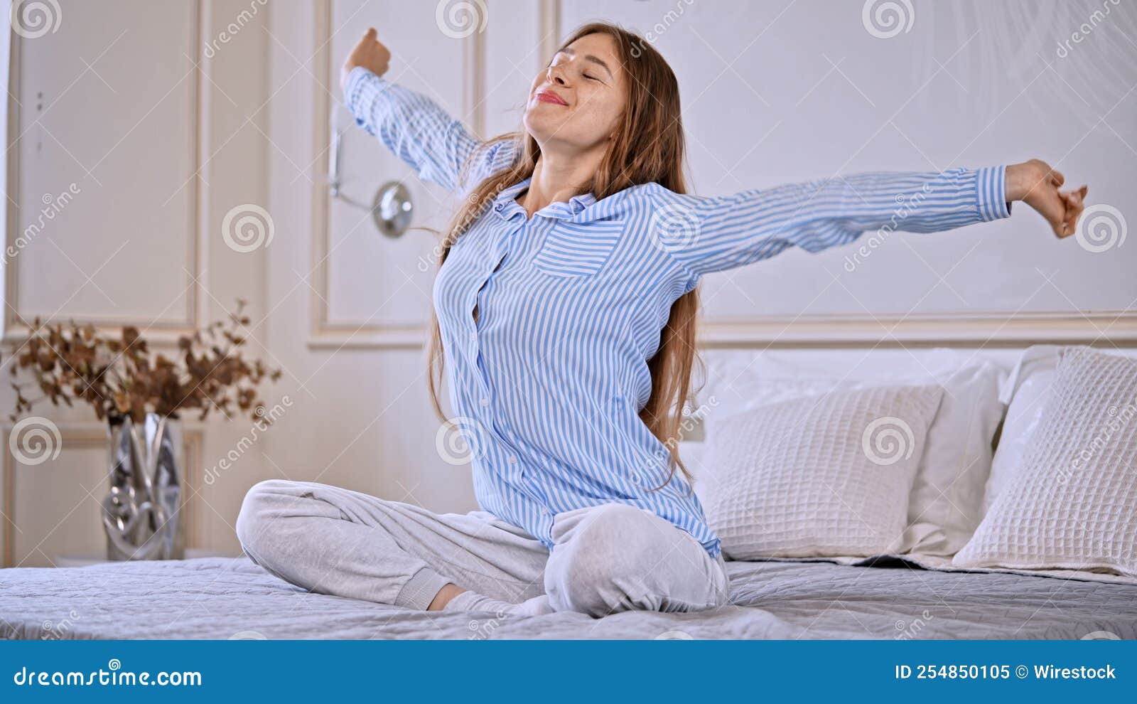Young Female Stretching after Waking Up on the Bed Stock Image - Image ...