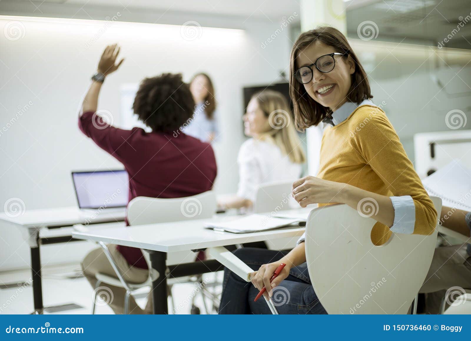 Young Female Student with Eyeglasses in the Classroom Stock Photo ...