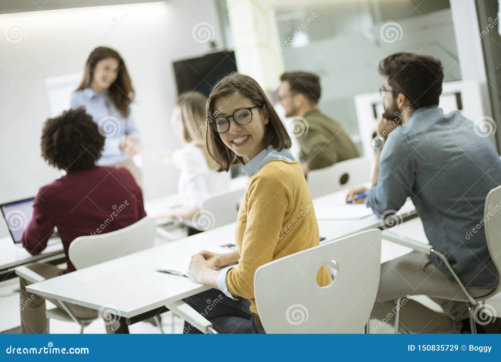 Young Female Student with Eyeglasses in the Classroom Stock Image ...