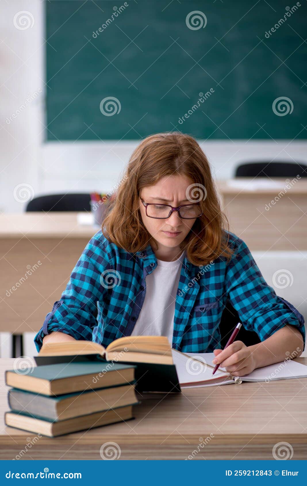 Young Female Student Preparing for Exam in the Classroom Stock Image ...