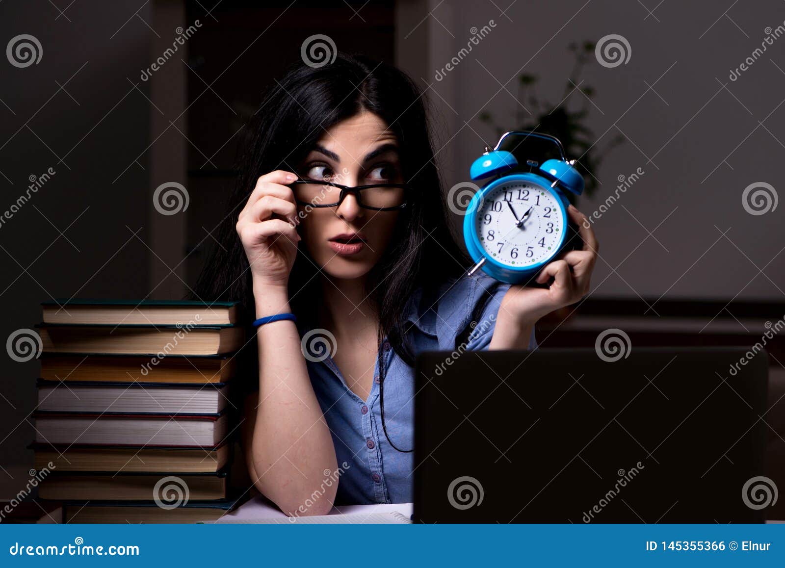 The Young Female Student Preparing for Exams at Night Time Stock Photo ...