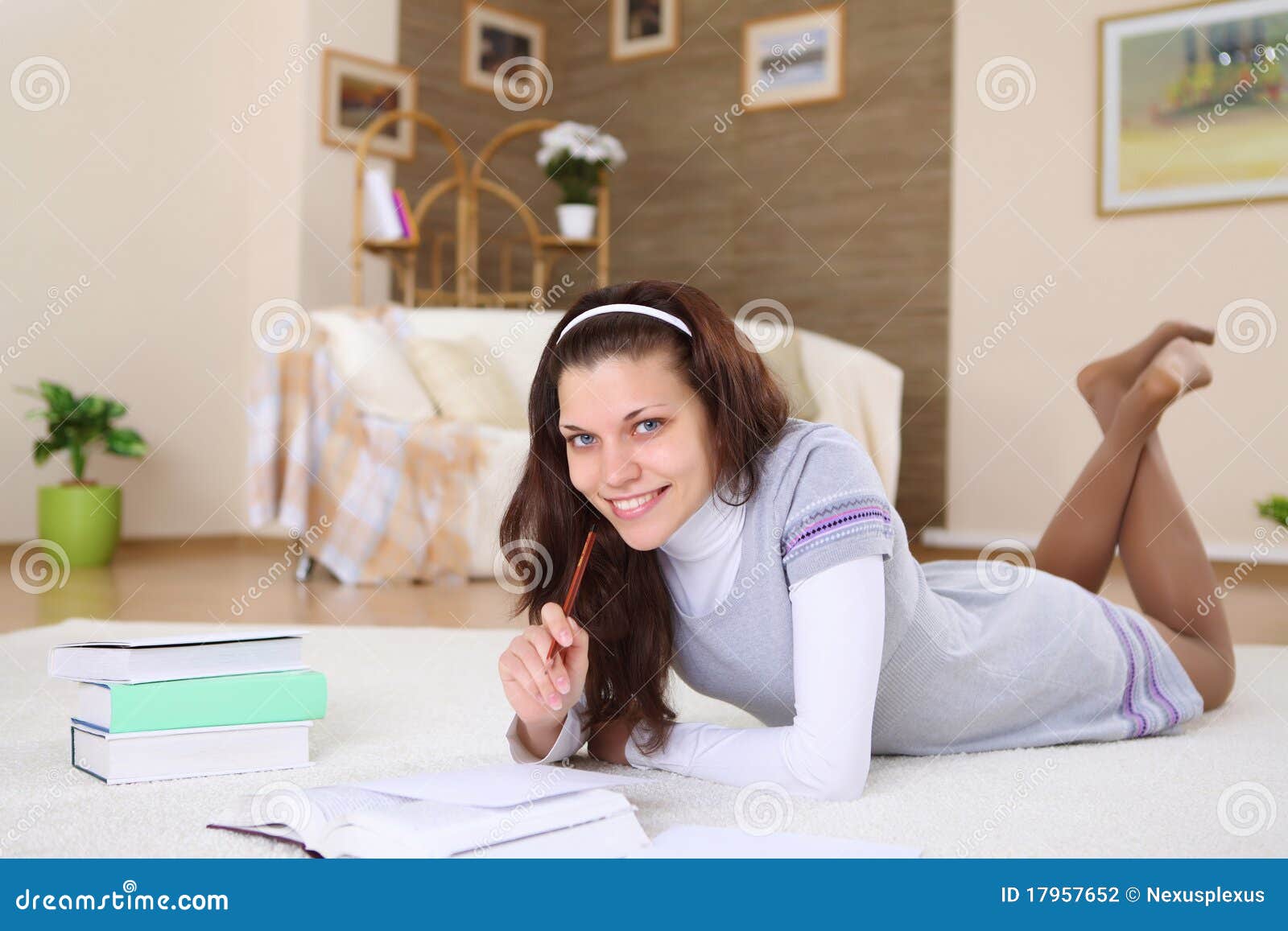 A Young Female Student Reading at Home Stock Photo - Image of indoors ...