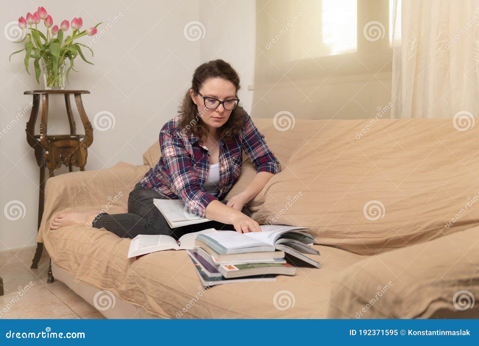 A Young Female Student Sitting at the Couch Stock Image - Image of ...