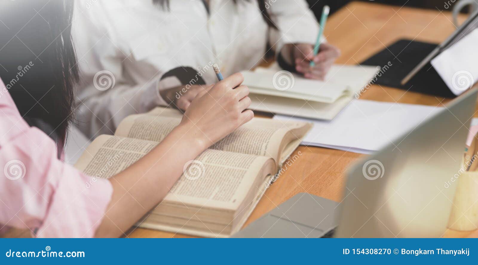 Young Female Students Doing Group Study Stock Photo - Image of school ...