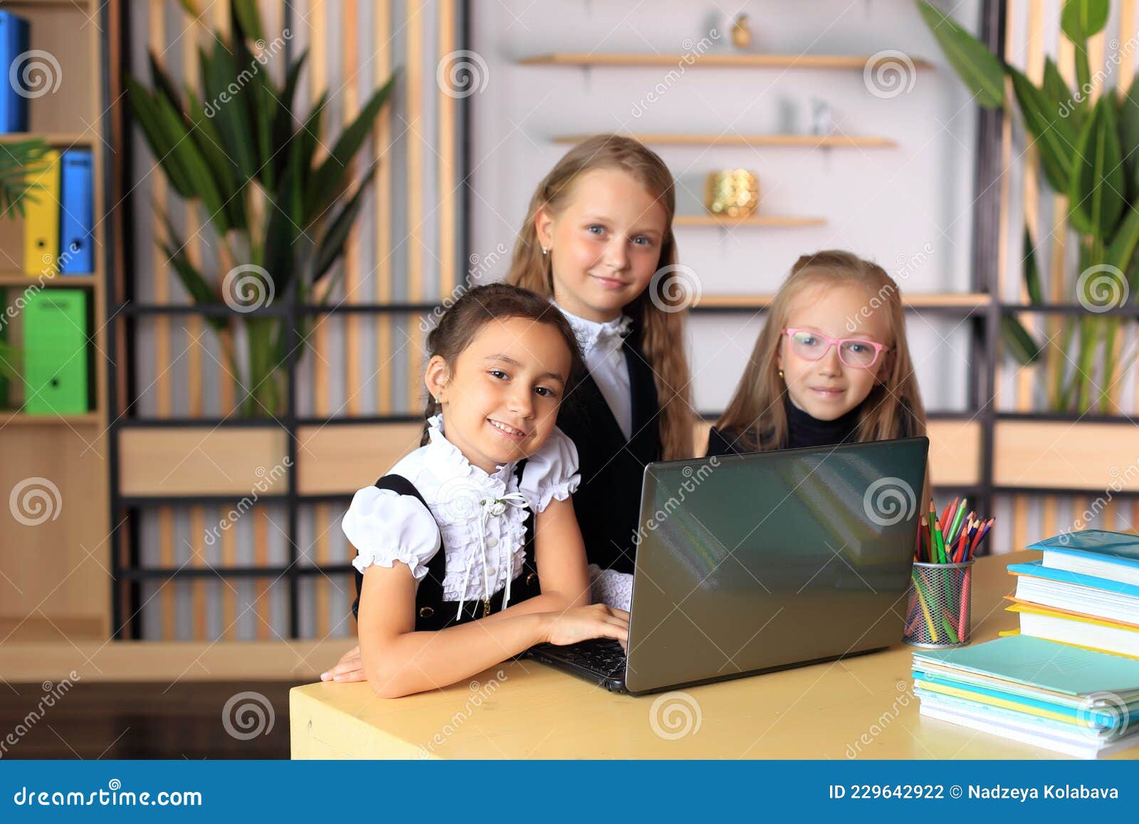 Young Female Students In School Uniforms Before The Lesson In The ... Young Female Students In School Uniforms Before The Lesson In The ...