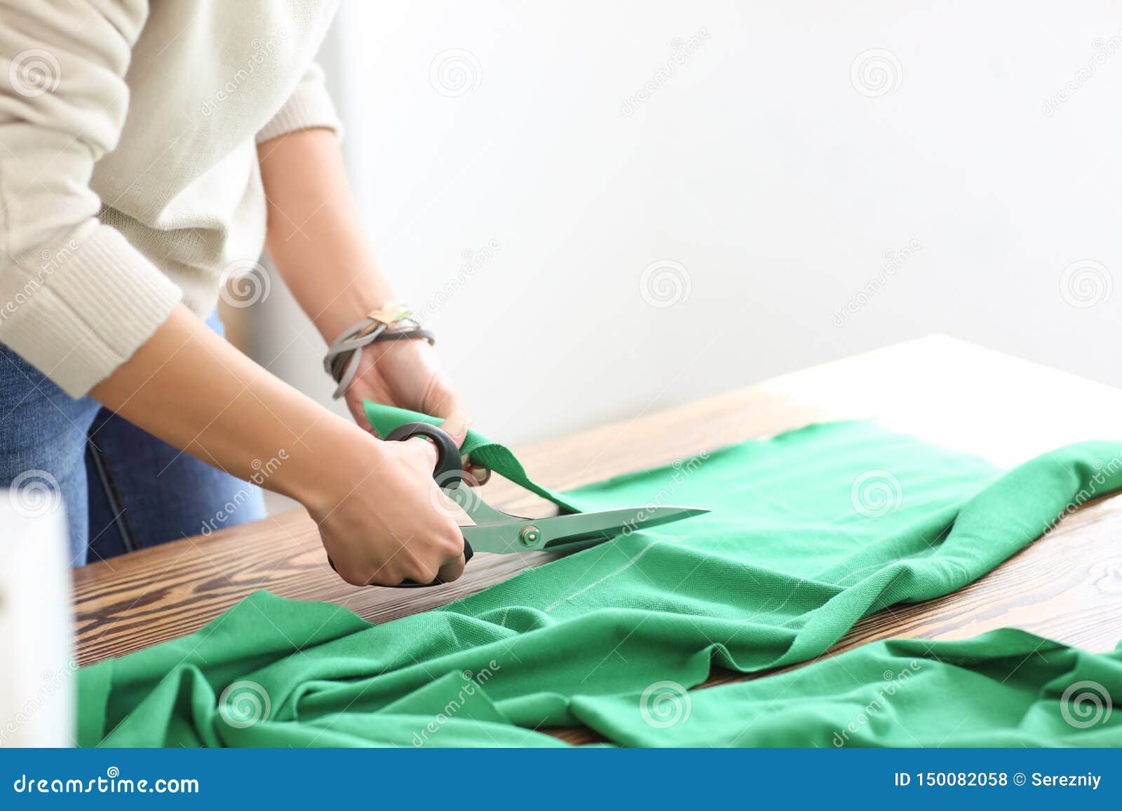 Young Female Tailor Cutting Fabric in Atelier Stock Photo - Image of ...