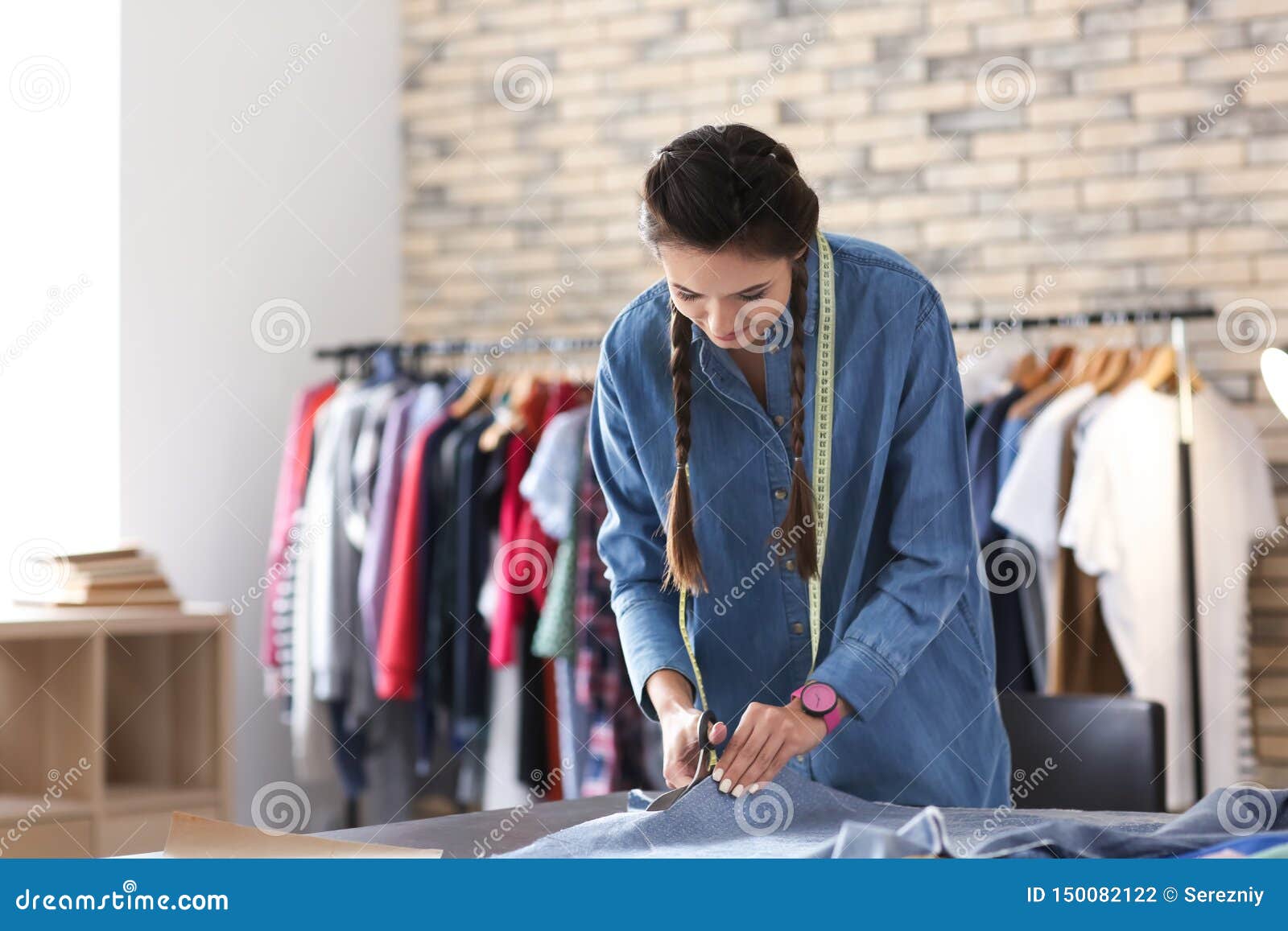 Young Female Tailor Cutting Fabric in Atelier Stock Photo - Image of ...