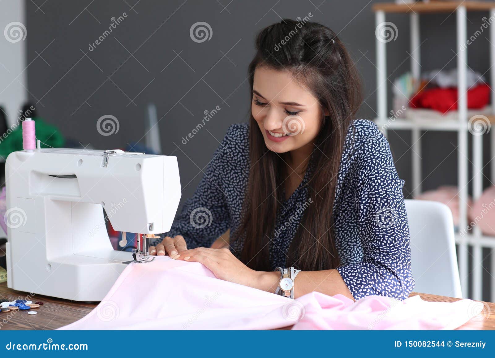 Young Female Tailor Using Sewing Machine in Atelier Stock Photo - Image ...