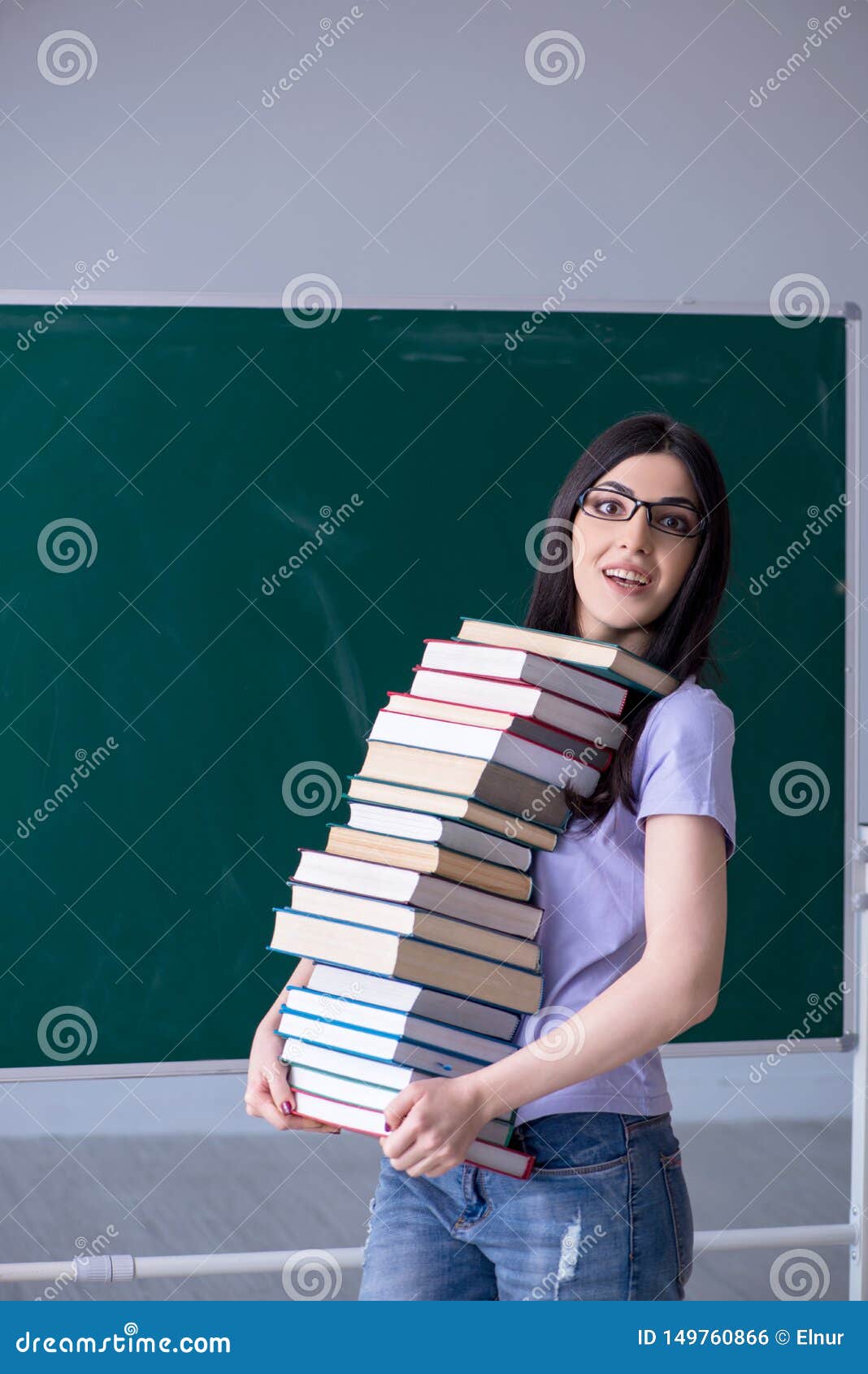 Young Female Teacher Student in Front of Green Board Stock Photo ...