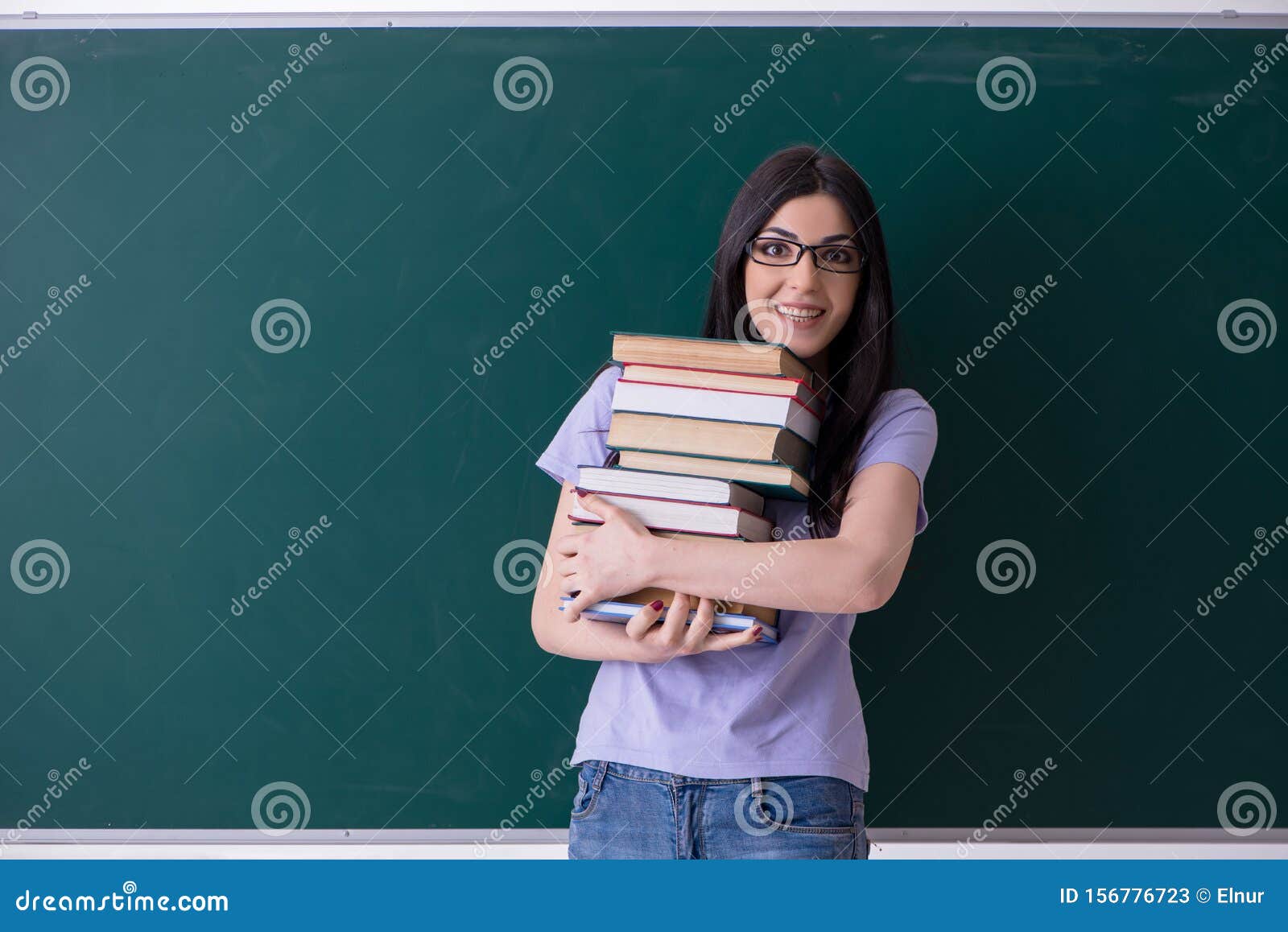 Young Female Teacher Student in Front of Green Board Stock Image ...