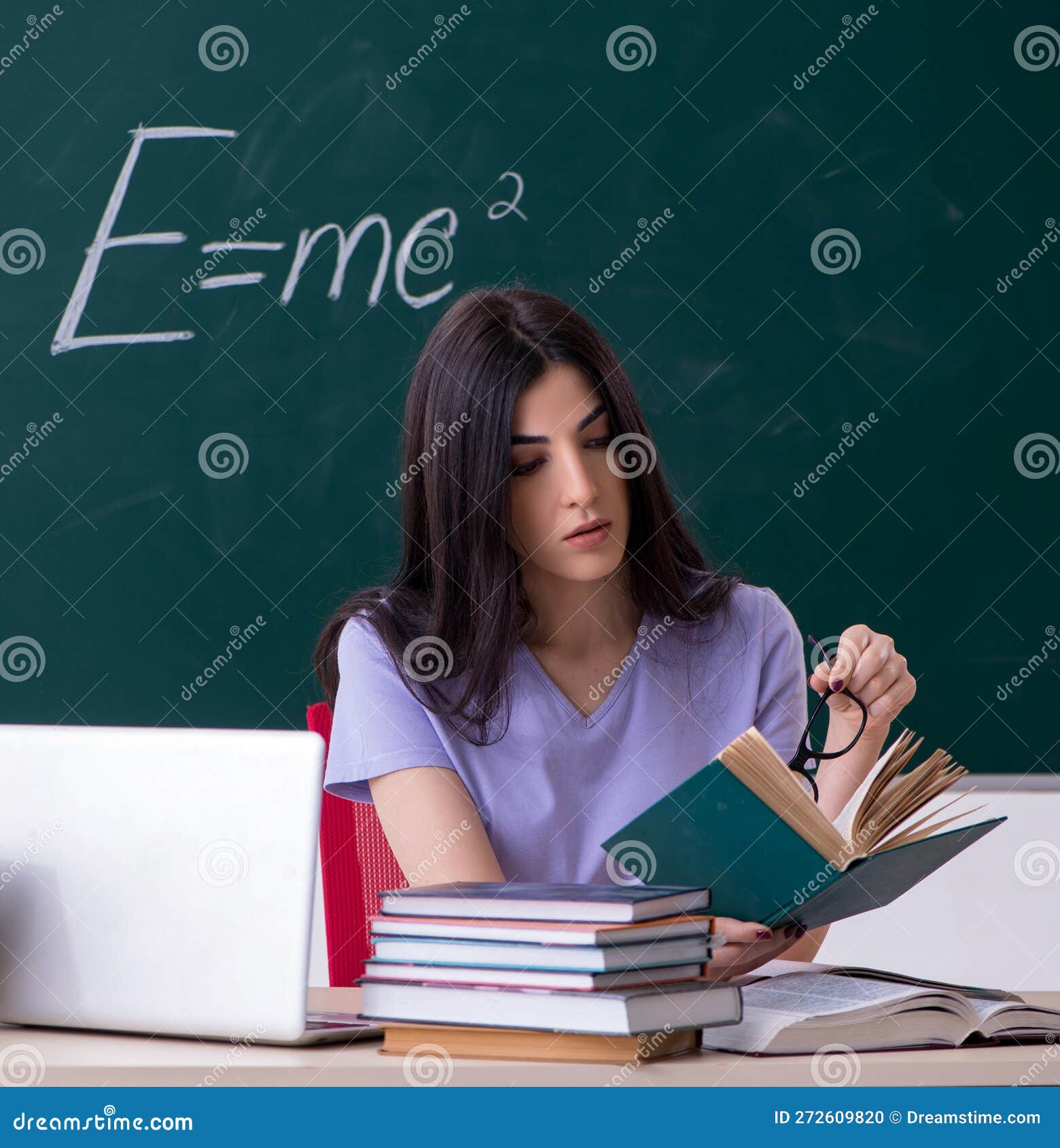 Young Female Teacher Student in Front of Green Board Stock Photo ...
