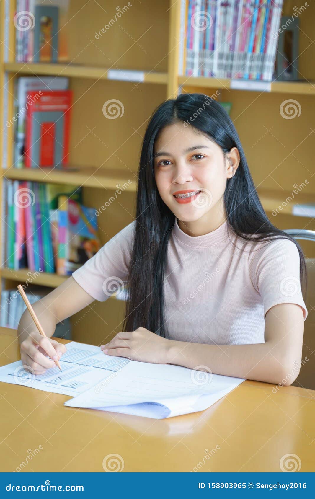 Young Female University Student Concentrate Doing Language Practice ...