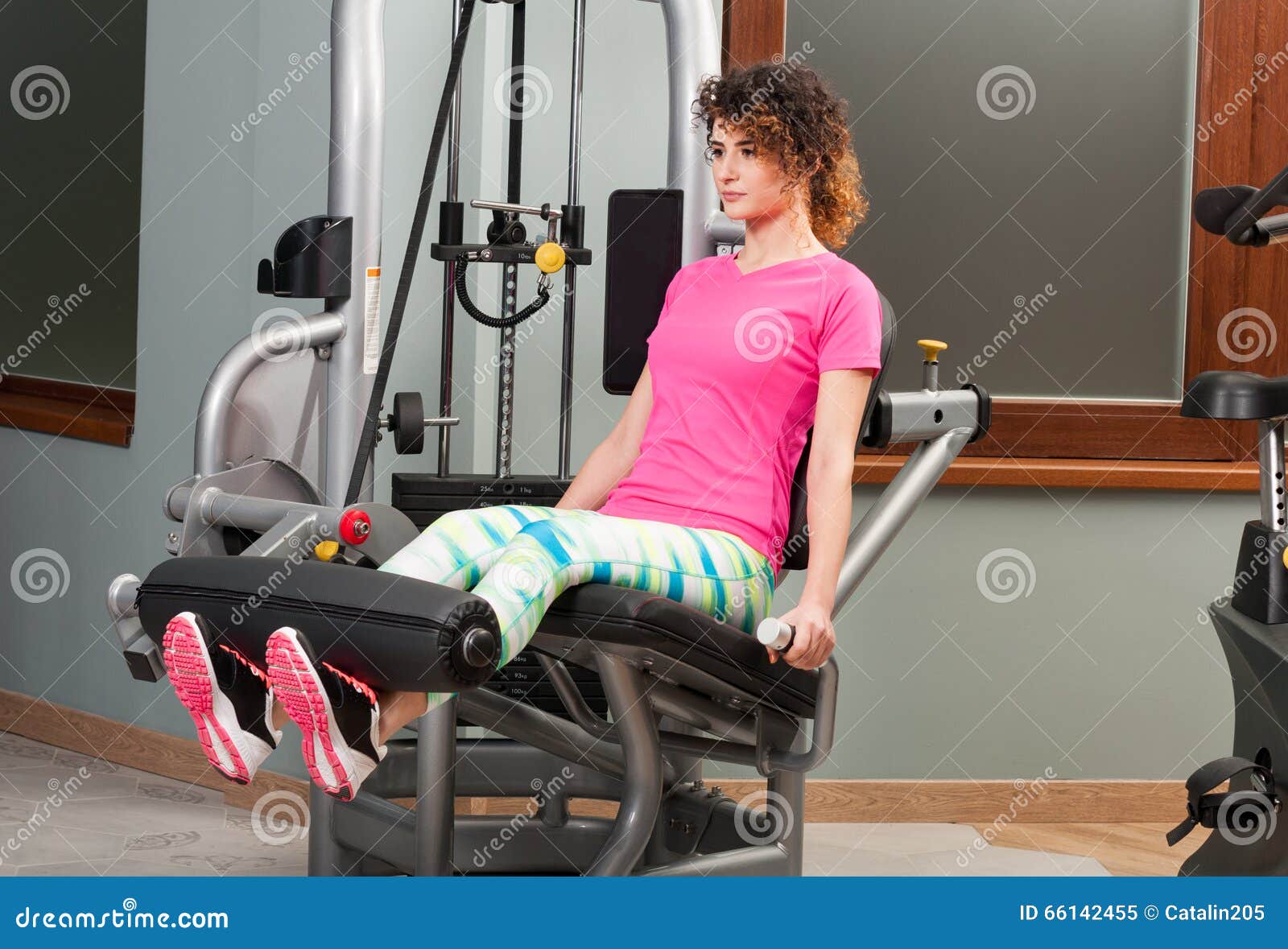 Young Female Using Lifting Leg Machine Stock Image - Image of handle ...