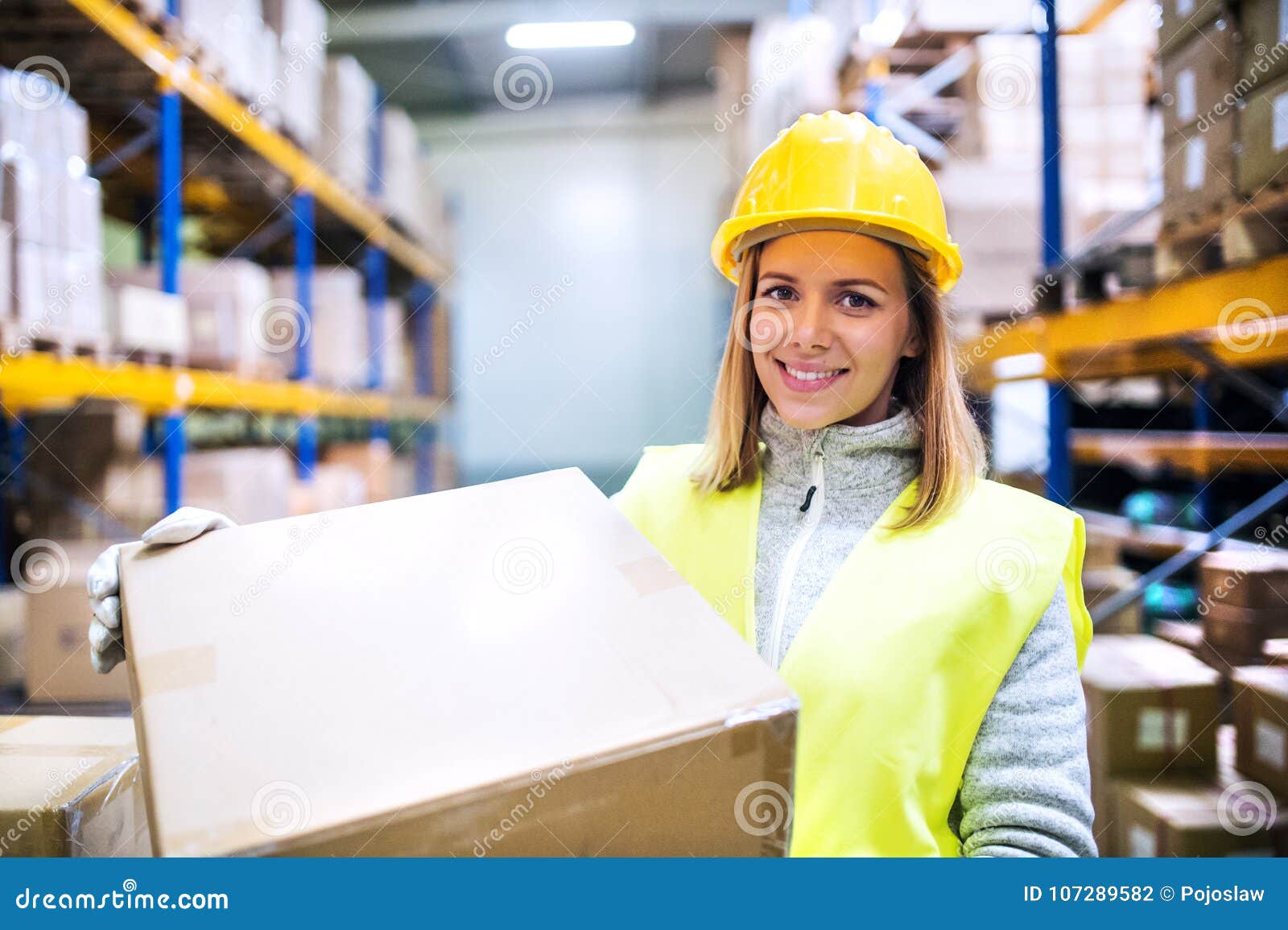 Female Warehouse Worker Loading Boxes. Stock Photo - Image of plastic ...