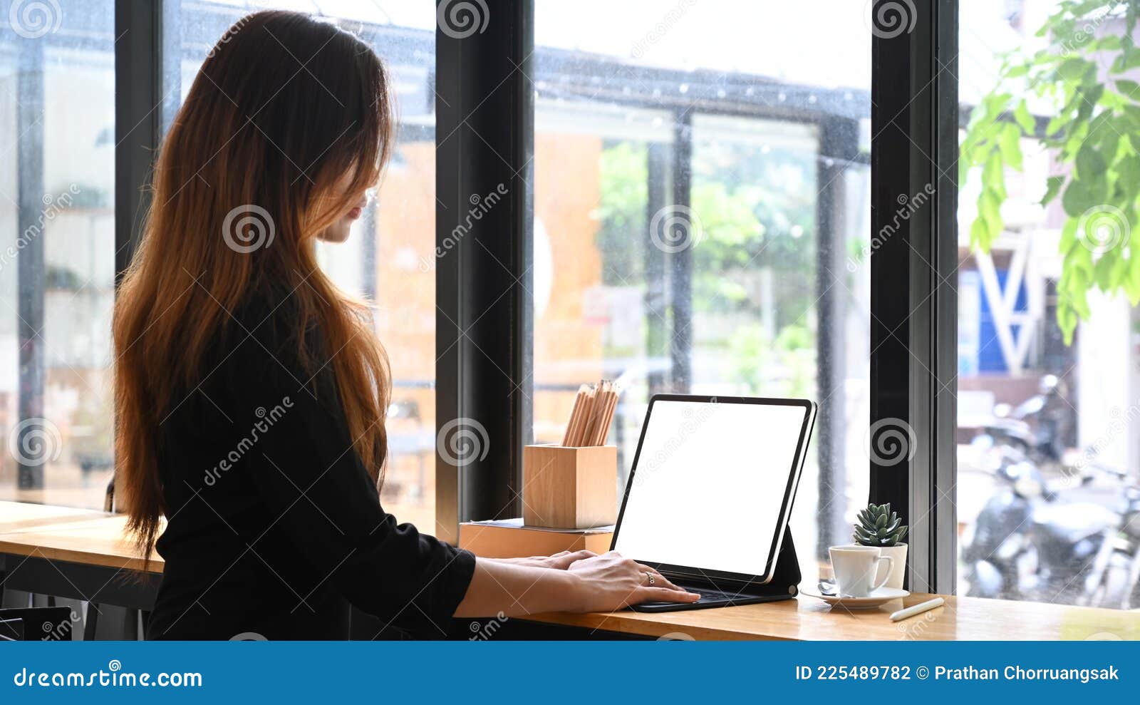 Young Female Working with Computer Tablet in Cafe. Stock Photo - Image ...