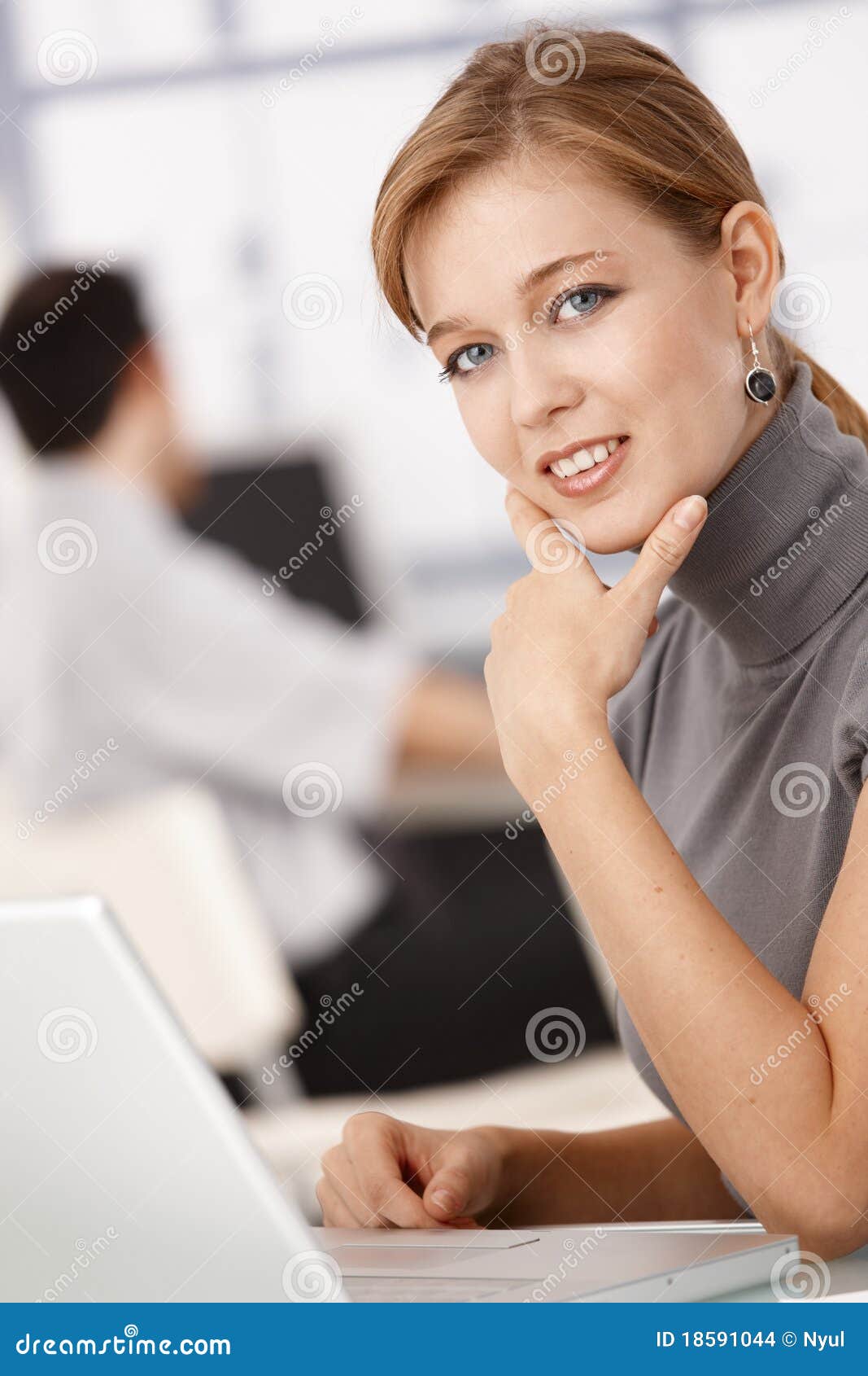 Young Female Working on Laptop in Office Smiling Stock Photo - Image of ...