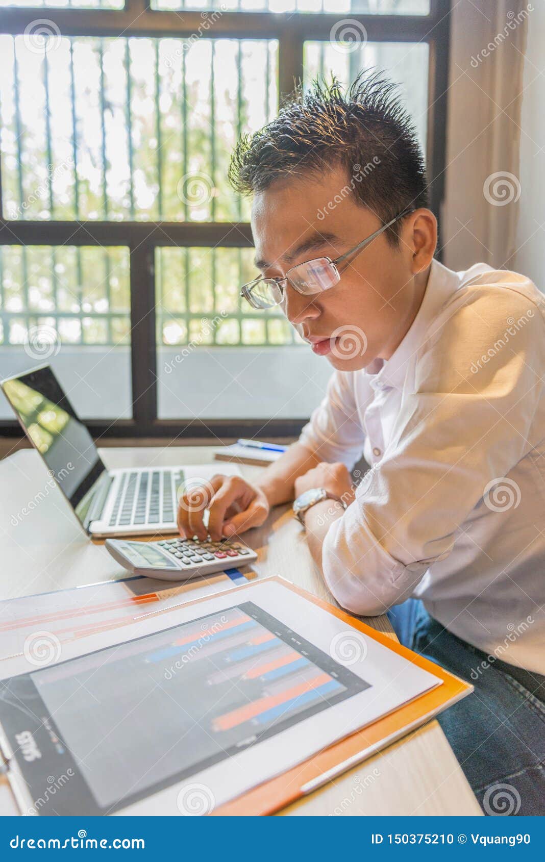 Young Financial Advisor in Glasses Working Analyzing Business Graph ...