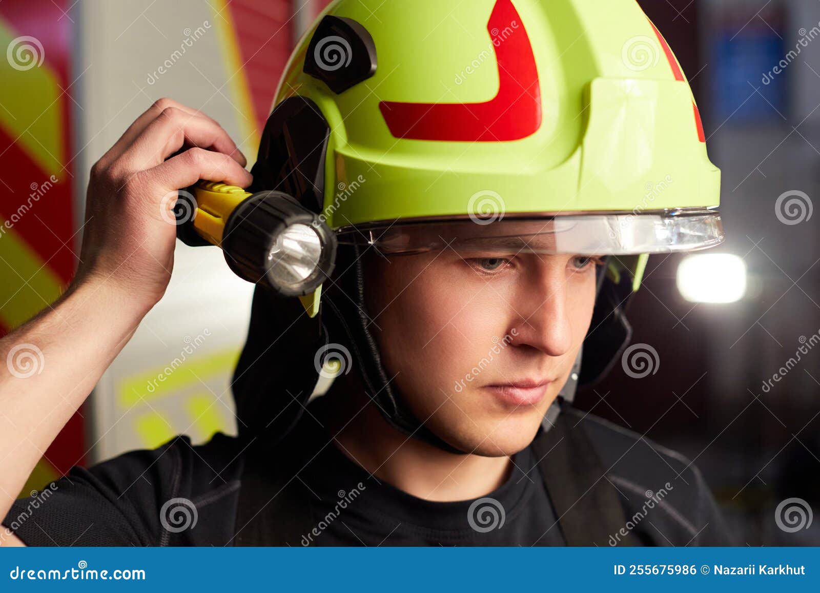 Young Fireman in Uniform Standing in Front of Firetruck, he is Ready ...