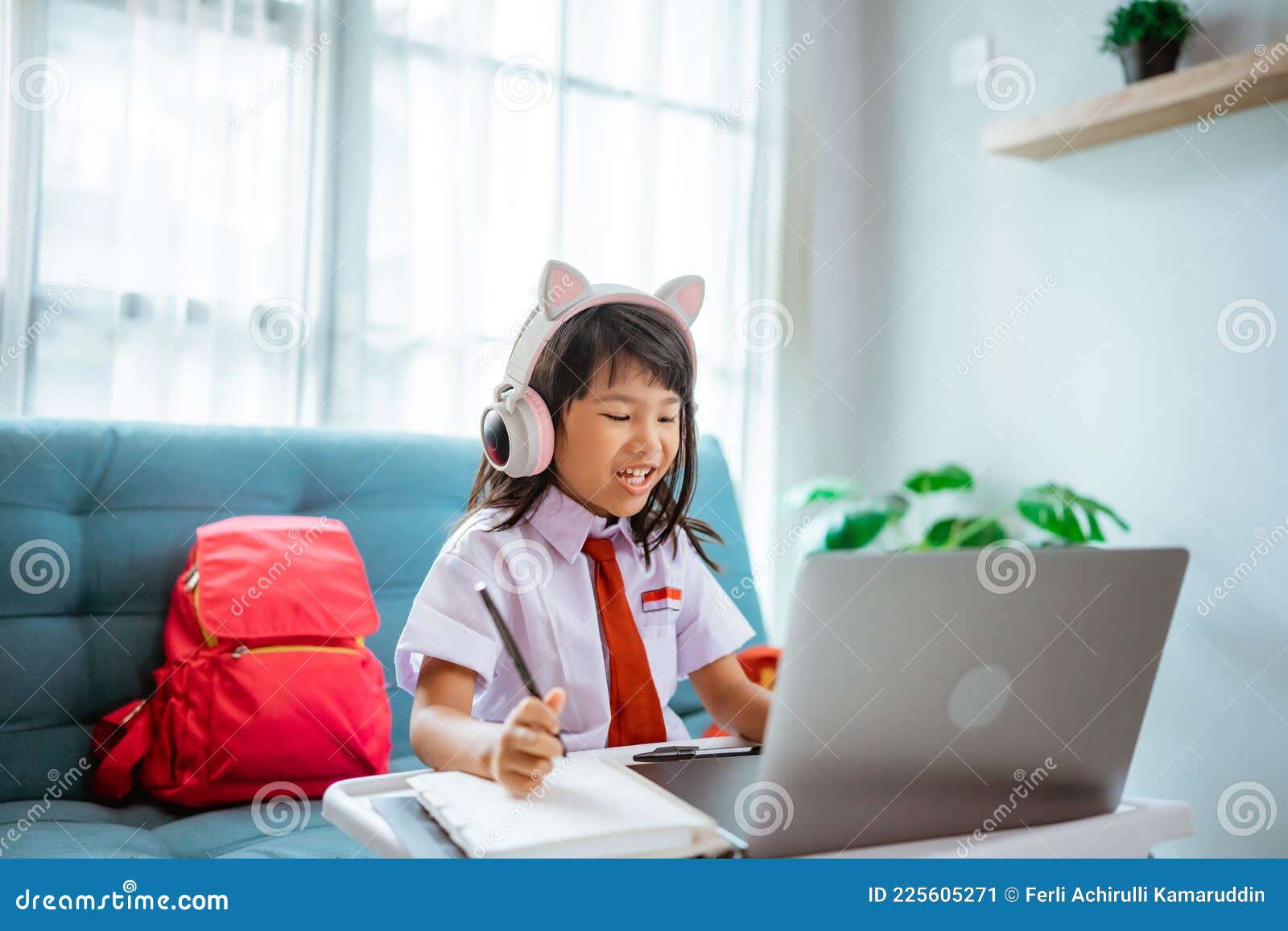 First Grade School Student with Uniform during Online Class Study with ...