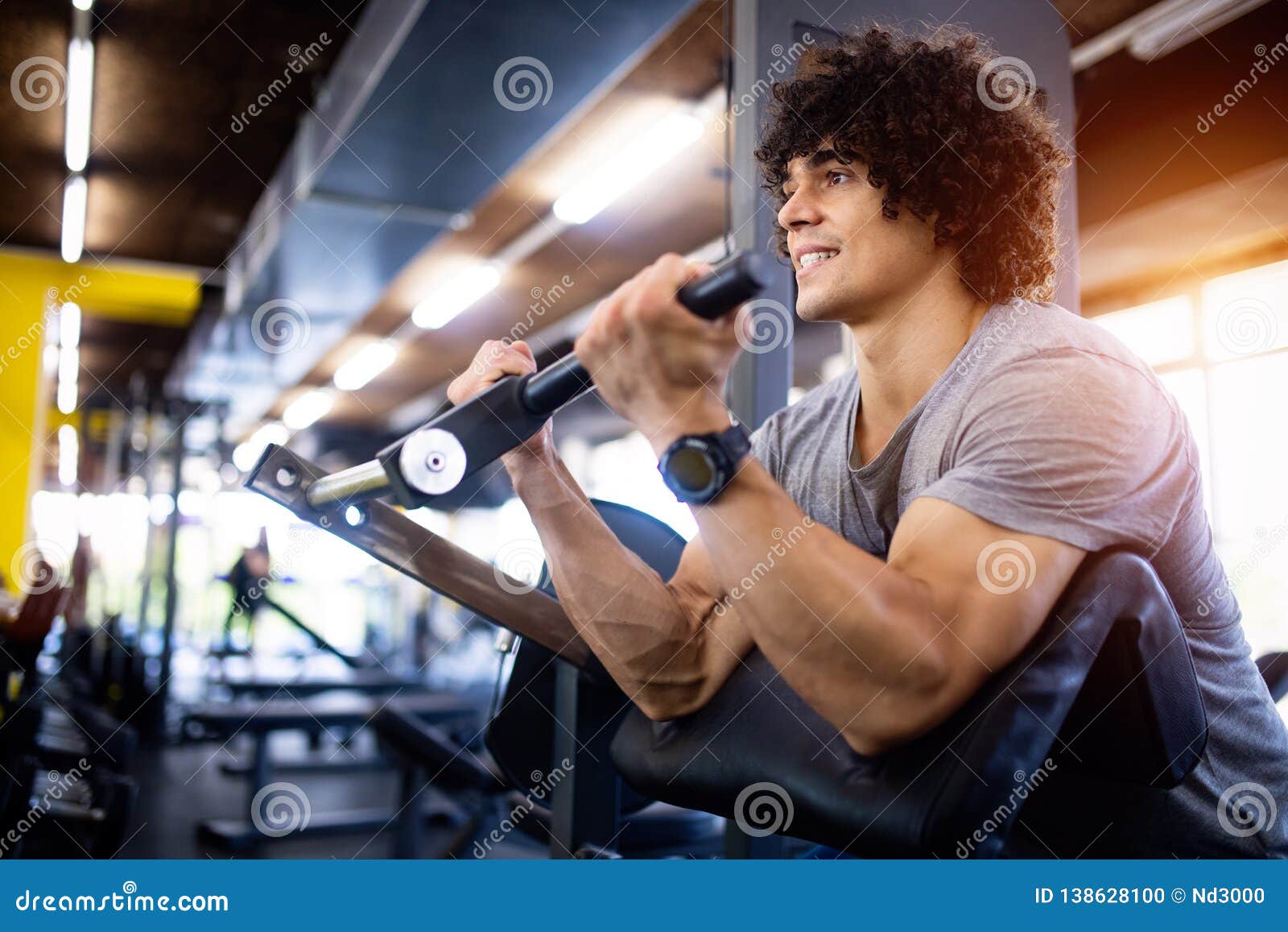 Young Fit Handsome Man Doing Exercises in Gym Stock Photo - Image of ...