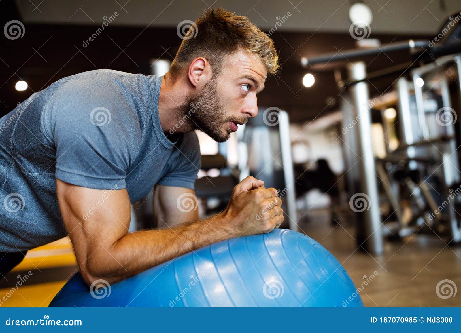 Young Handsome Man Doing Exercises in Gym Stock Image - Image of biceps ...