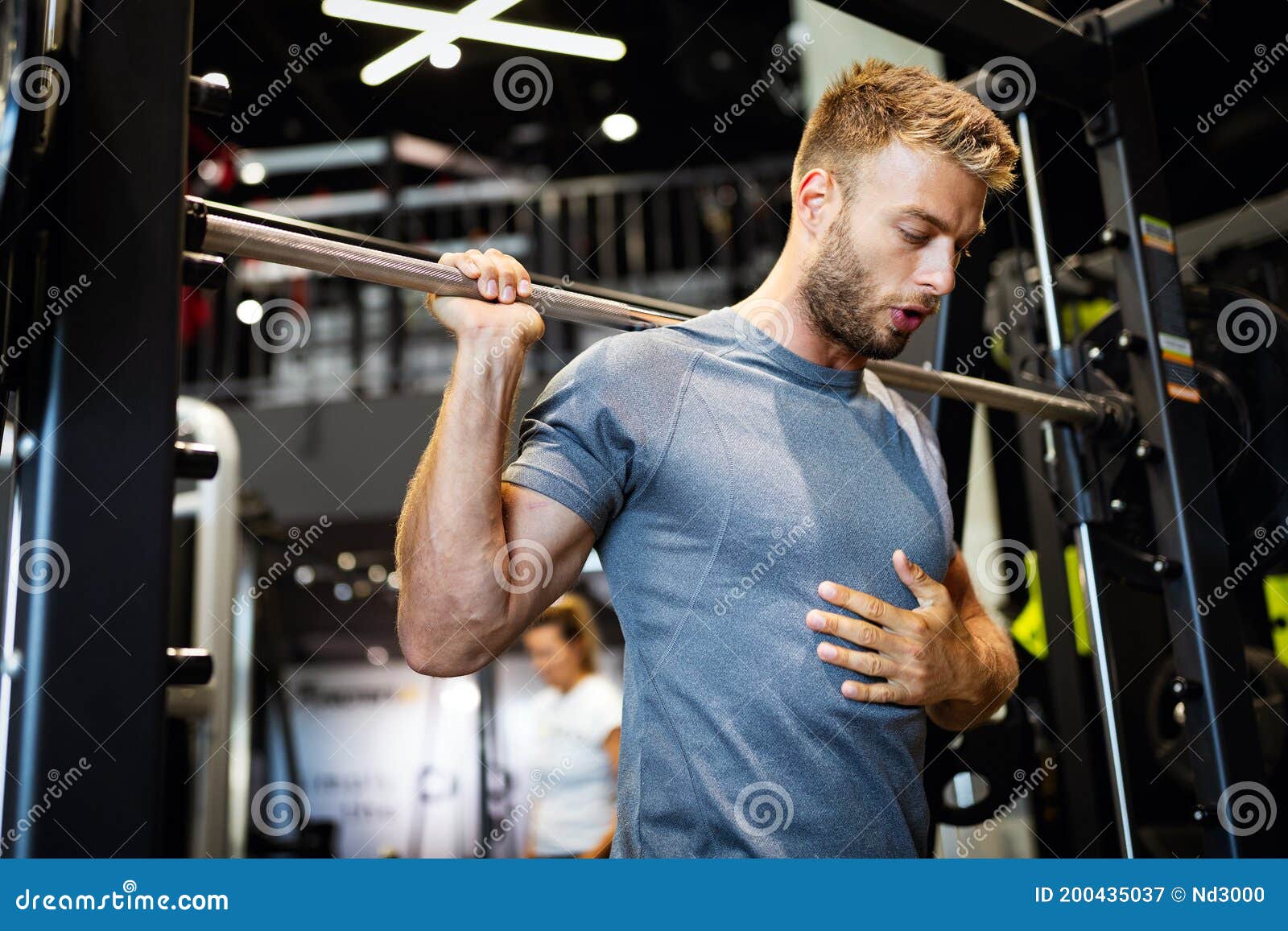 Young Handsome Man Doing Exercises in Gym Stock Image - Image of ...