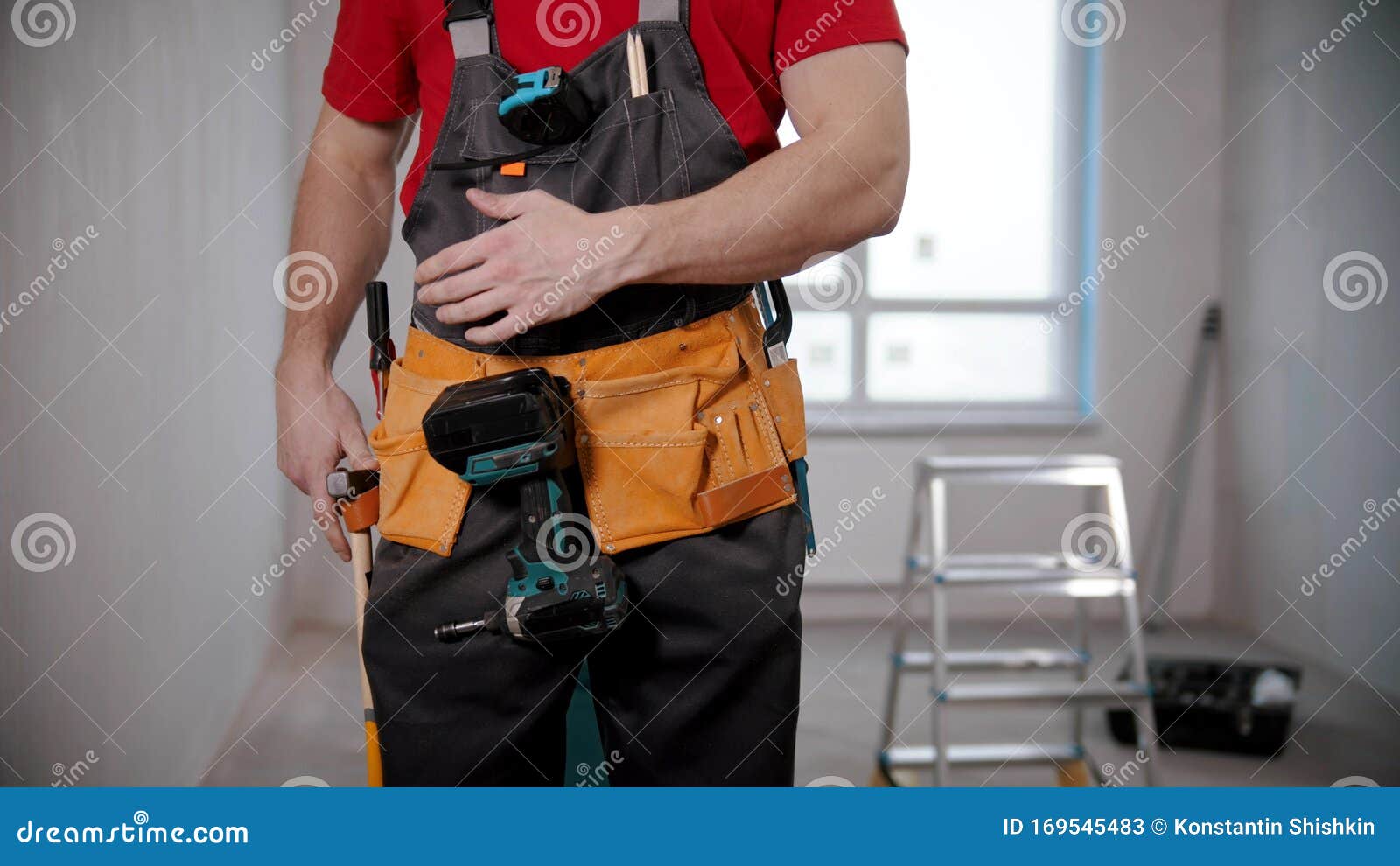 A Young Fit Man Worker Wearing a Tool Belt Stock Image - Image of ...