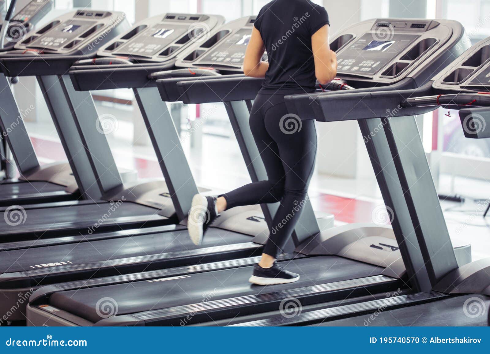 Young Fit Woman Running on Treadmill Stock Photo - Image of machines ...
