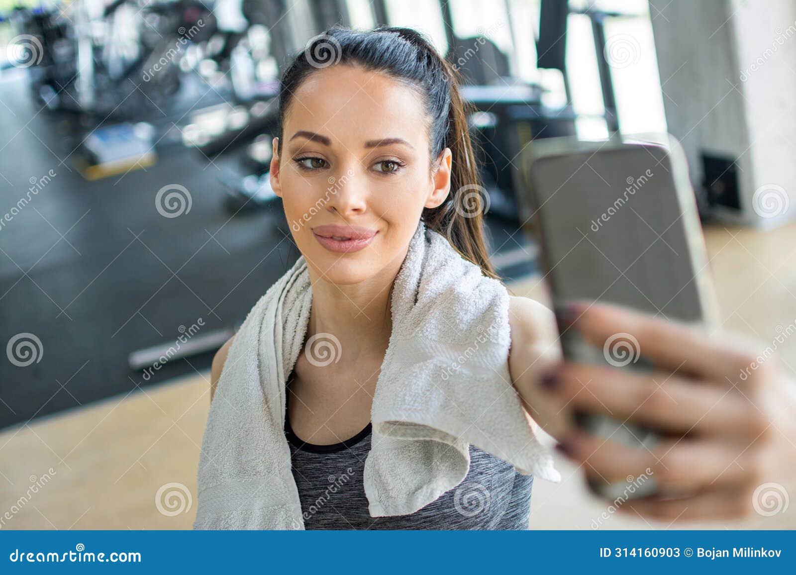 Young Fitness Woman Taking Selfies After Training In The Gym Stock