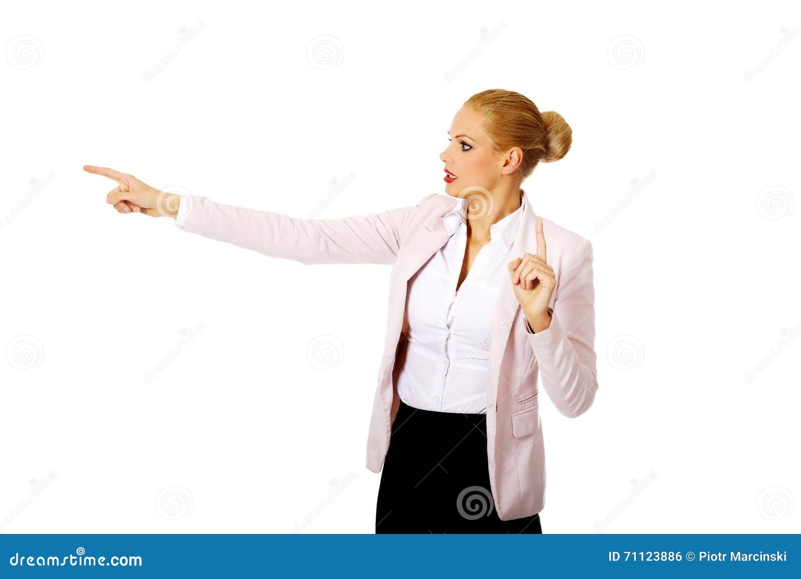 Young Focus Business Woman Explaining Something and Pointing at Board ...
