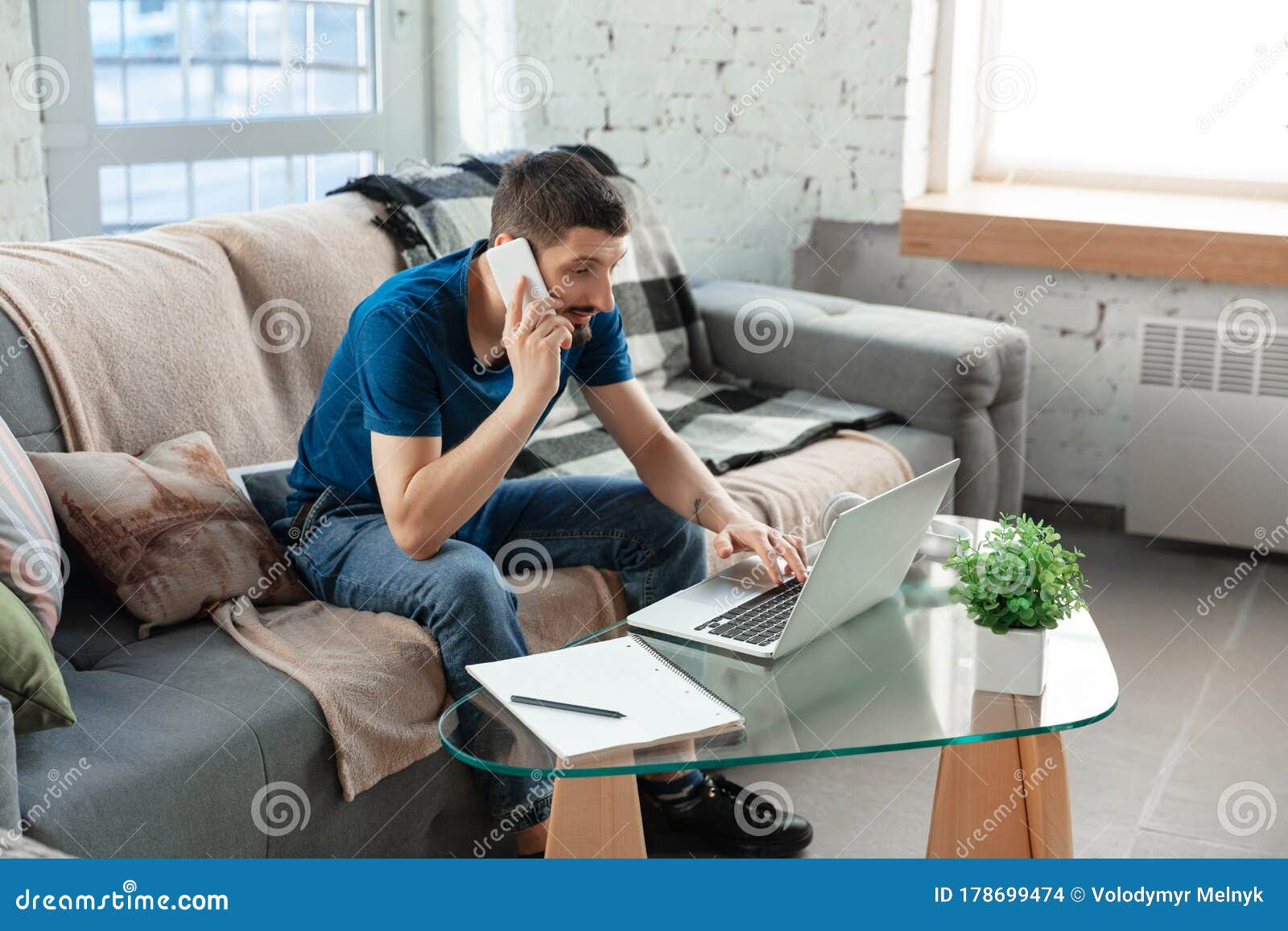 Young Focused Man Studying at Home during Online Courses or Free ... Young Focused Man Studying at Home during Online Courses or Free ...