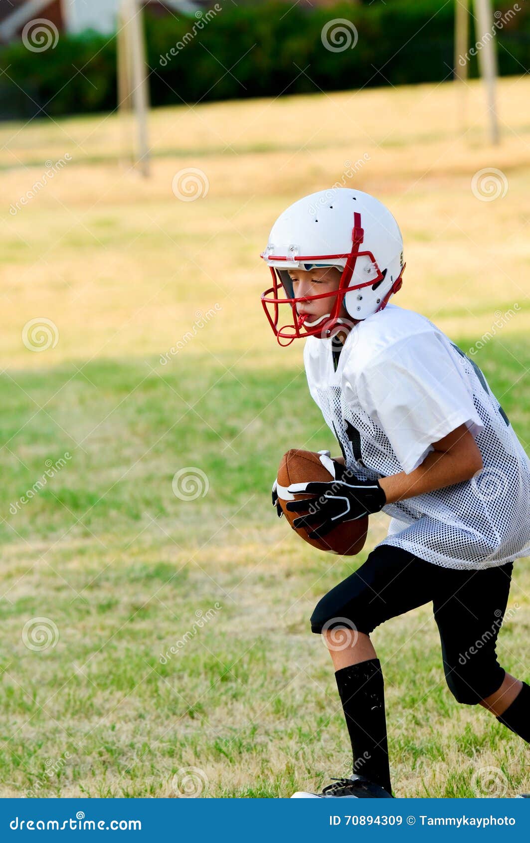 Young Football Player Catching Ball. Stock Image - Image of athlete ...
