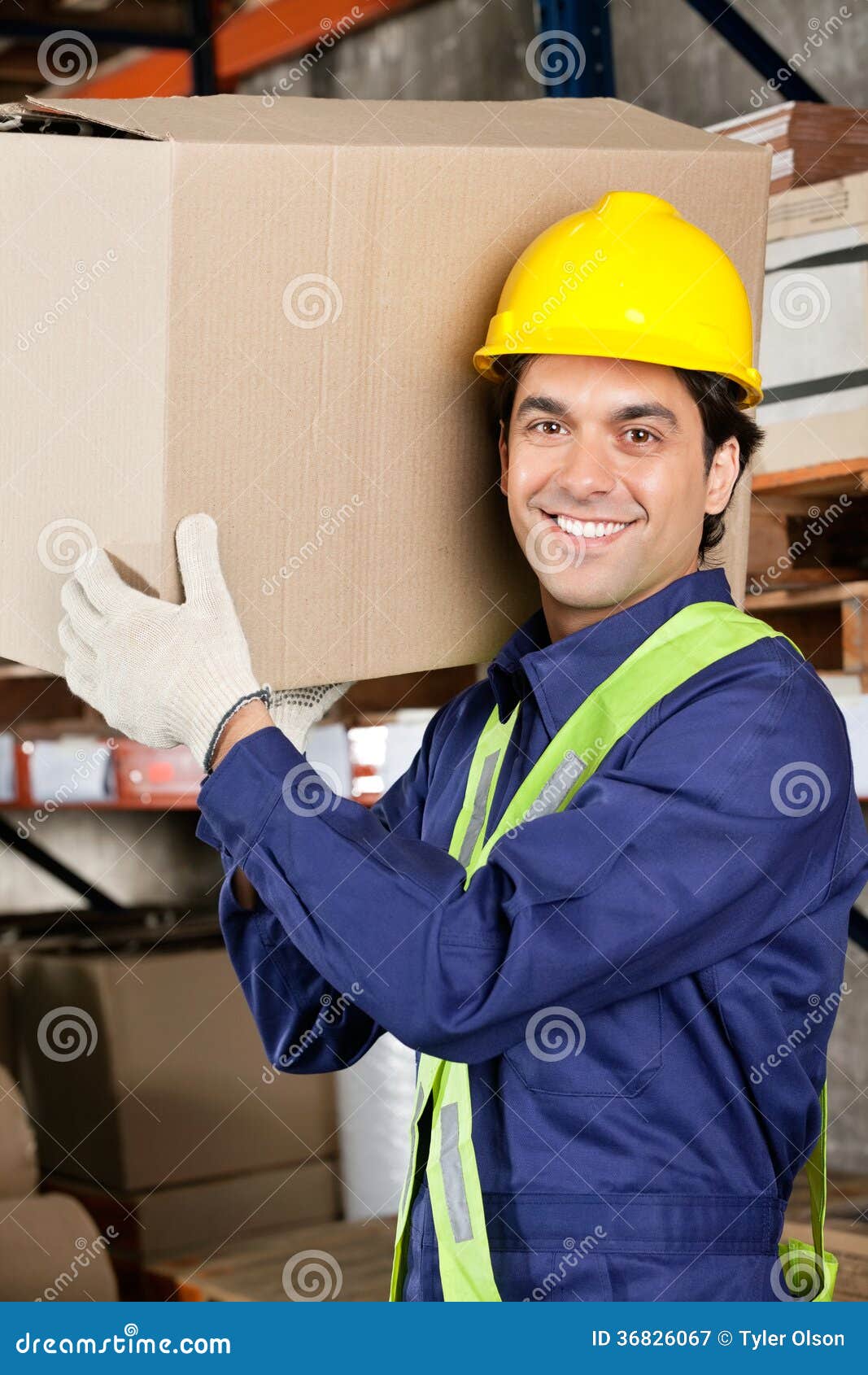 Young Foreman Lifting Cardboard Box Stock Image - Image of package ...