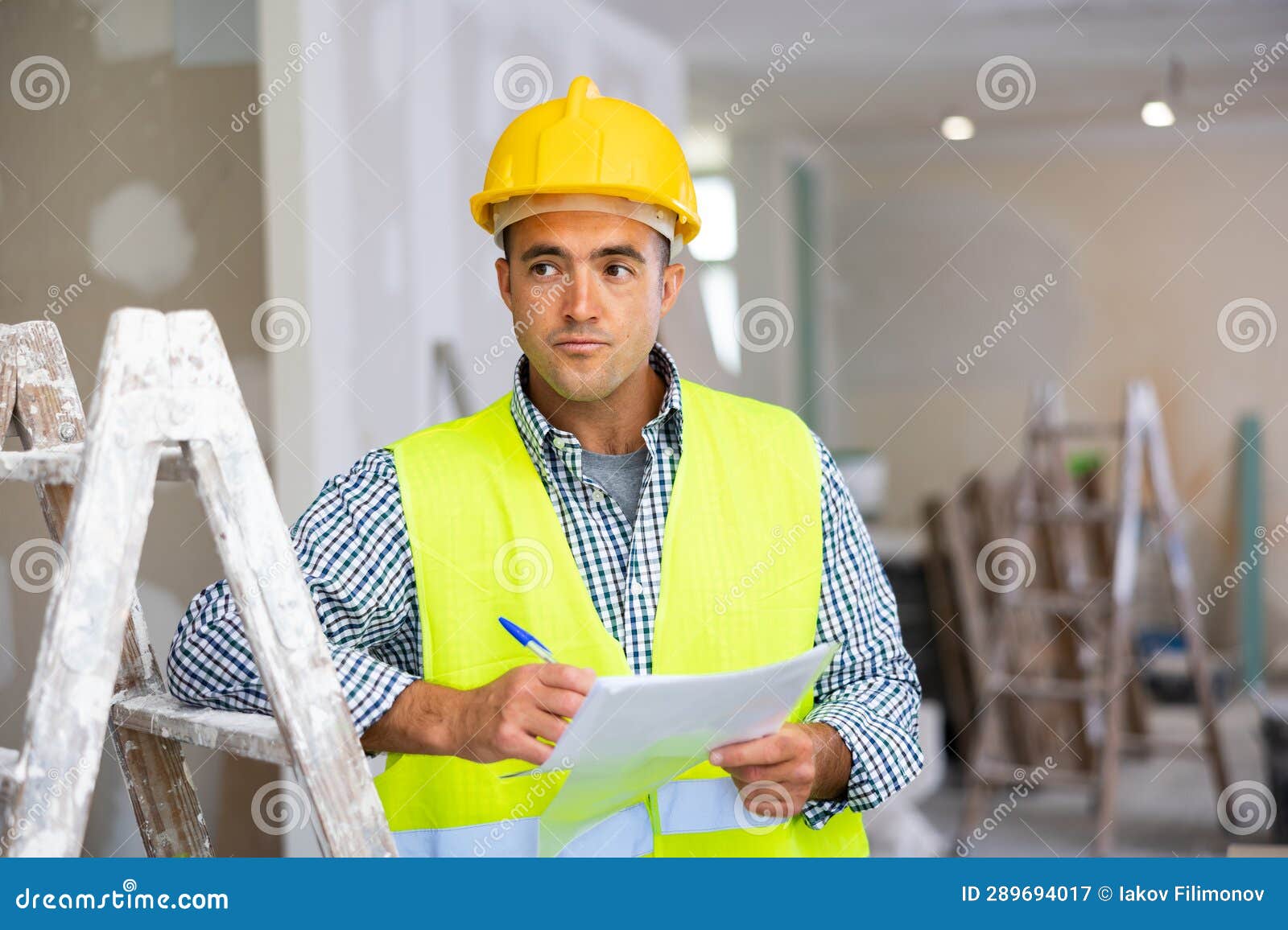 Young Foreman Checks the Completed Construction Work and Signs the ...