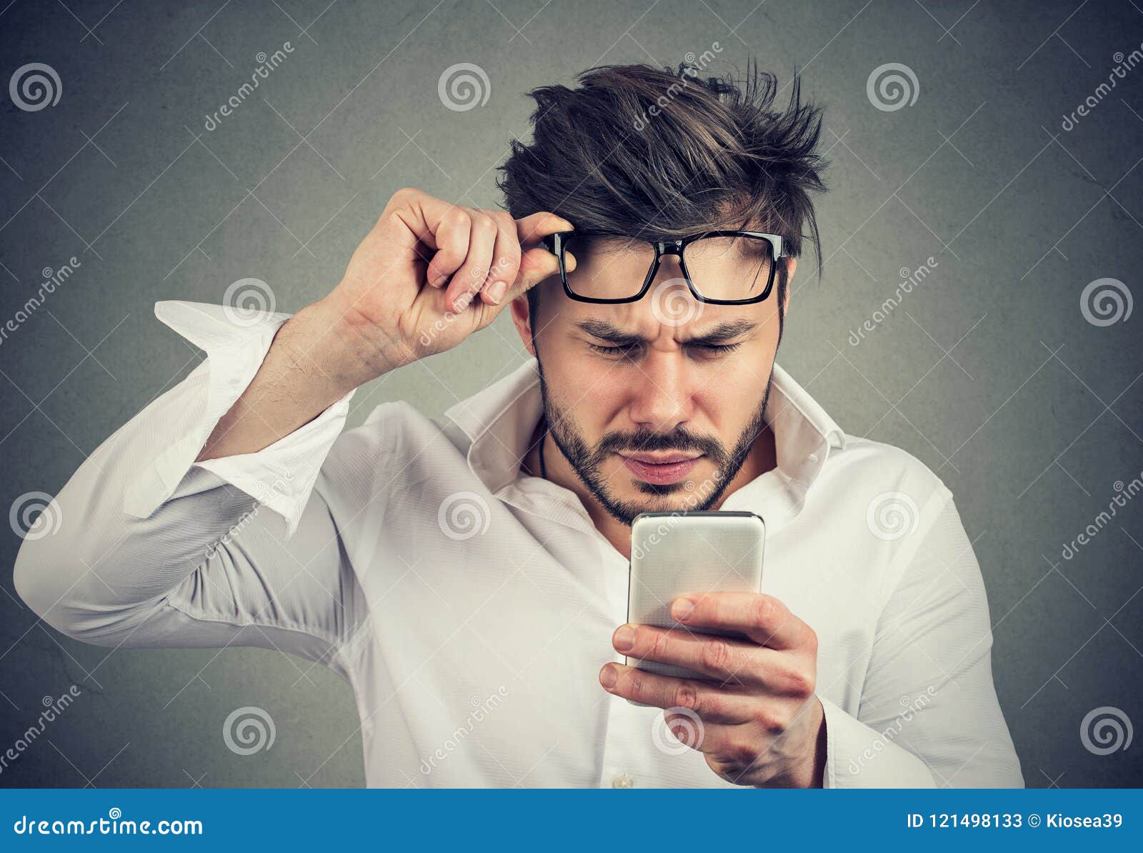 Confused Man Reading Phone With Difficulties Stock Image Image Of