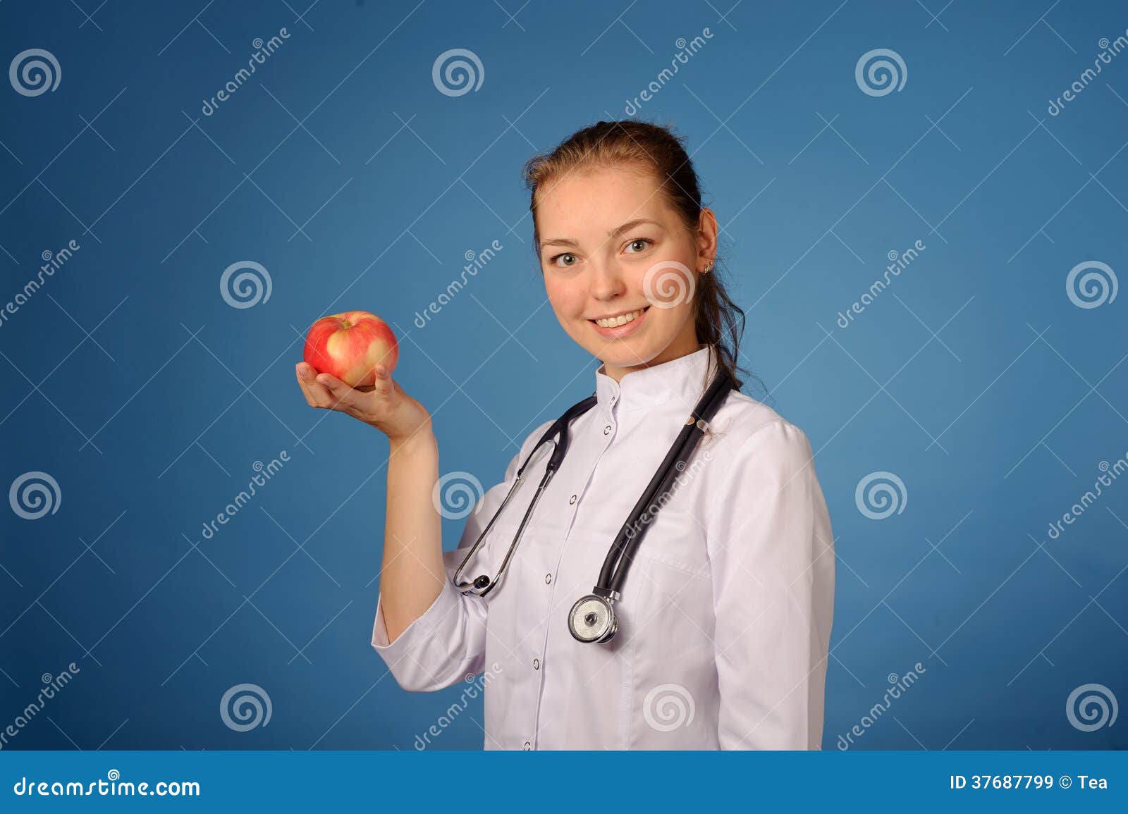 Young Friendly Female Doctor with Apple Stock Image - Image of girl ...