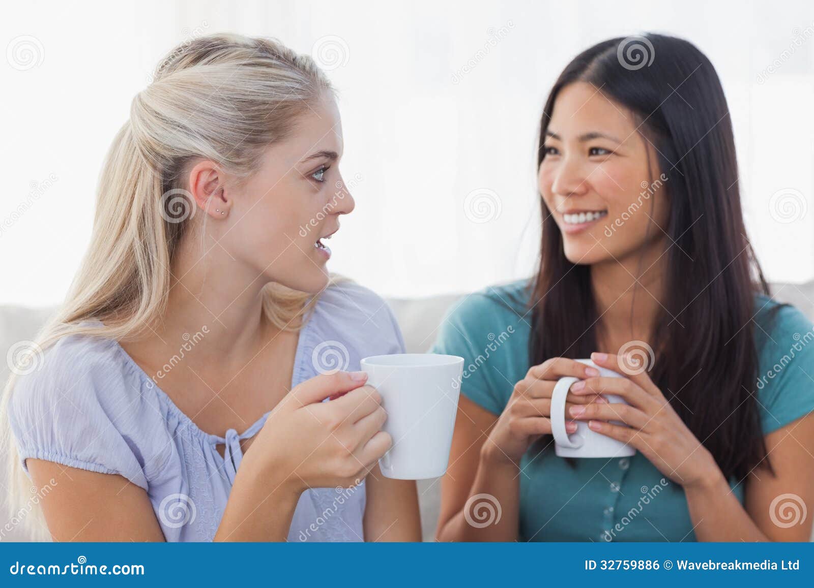 Young Friends Chatting Over Cups of Coffee Stock Photo - Image of adult ...