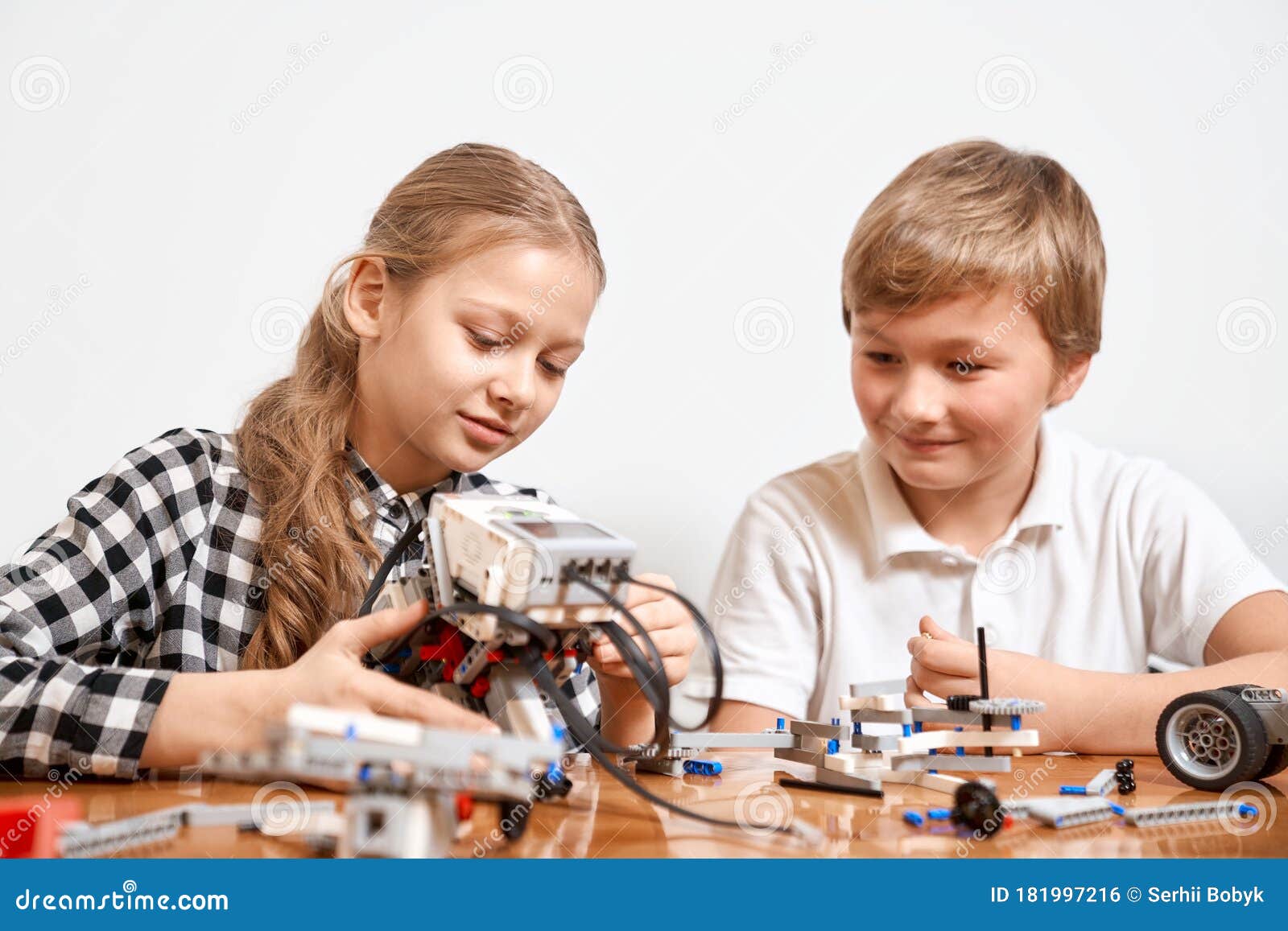 Young Friends Creating Robot Using Building Kit. Stock Photo - Image of ...