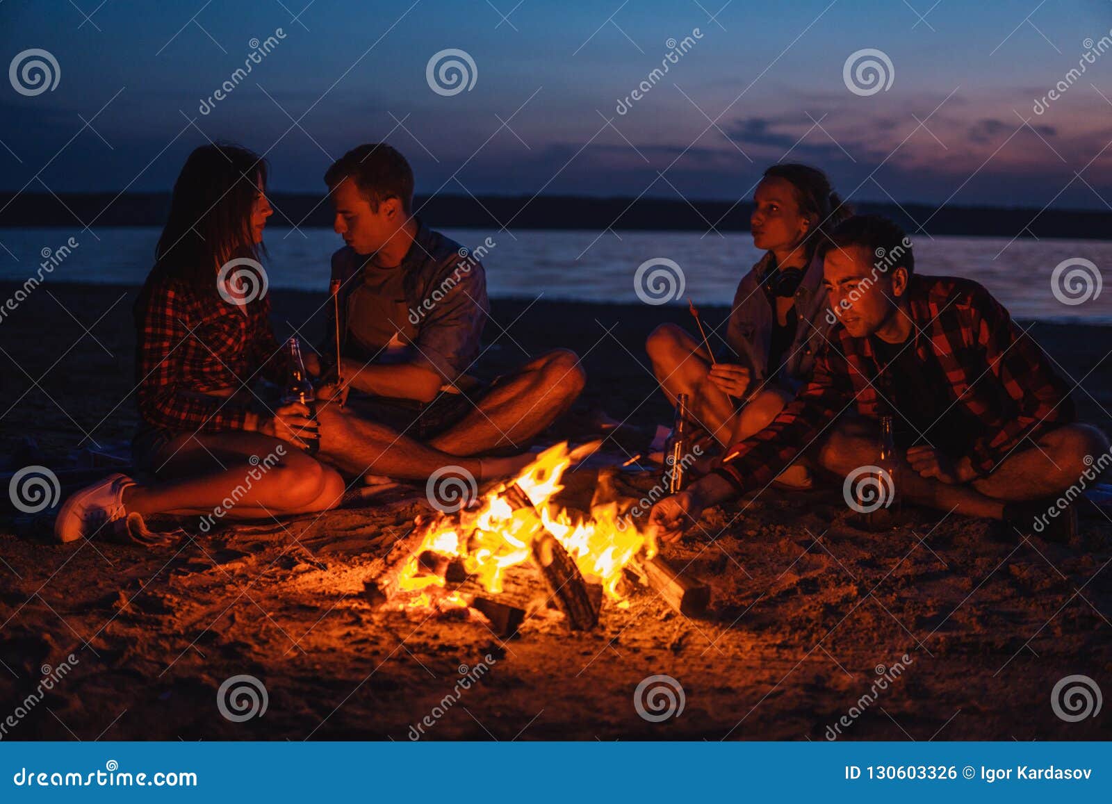 Young Friends Have Picnic with Bonfire on the Beach Stock Photo - Image ...