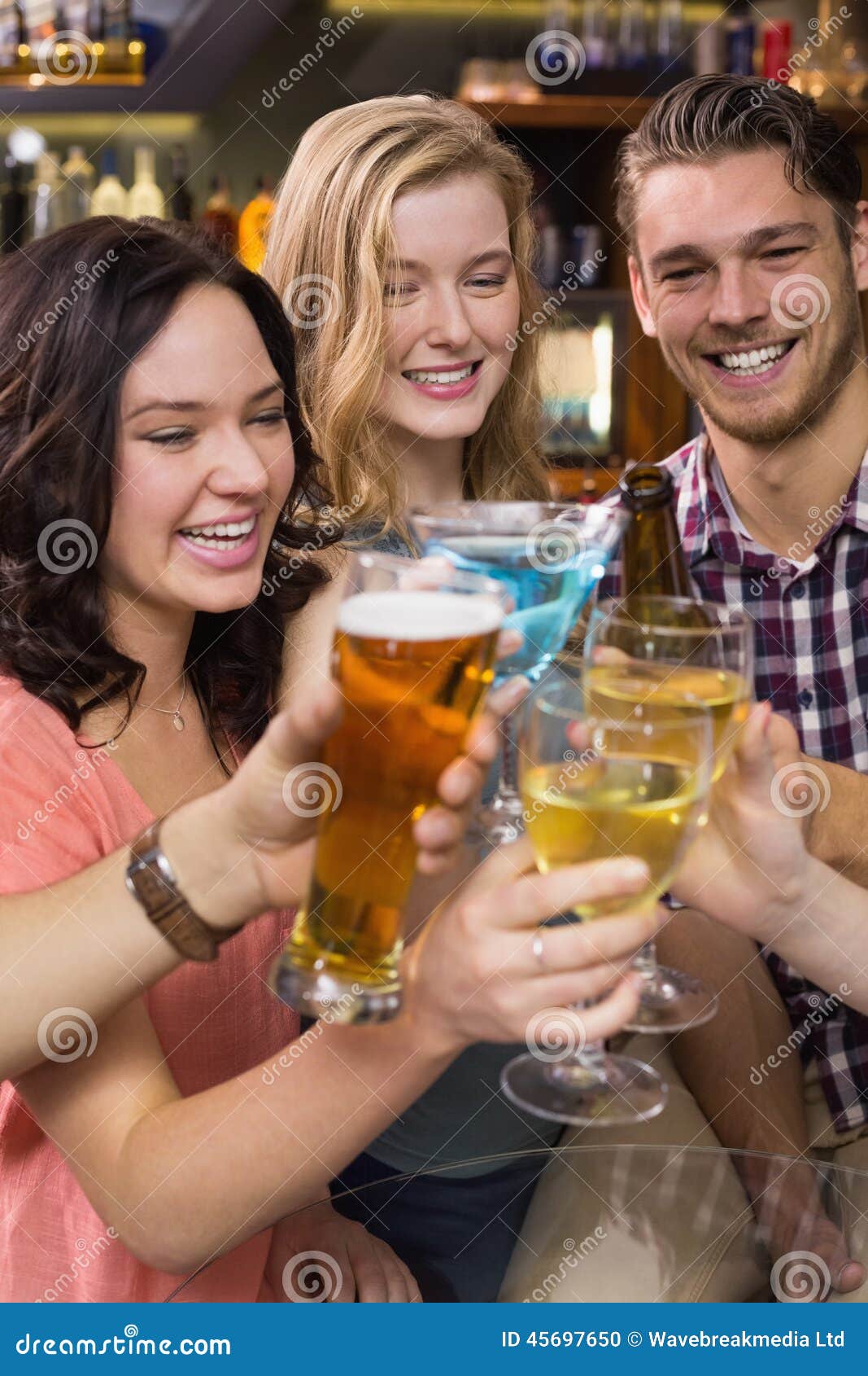 Young Friends Having a Drink Together Stock Photo - Image of male ...