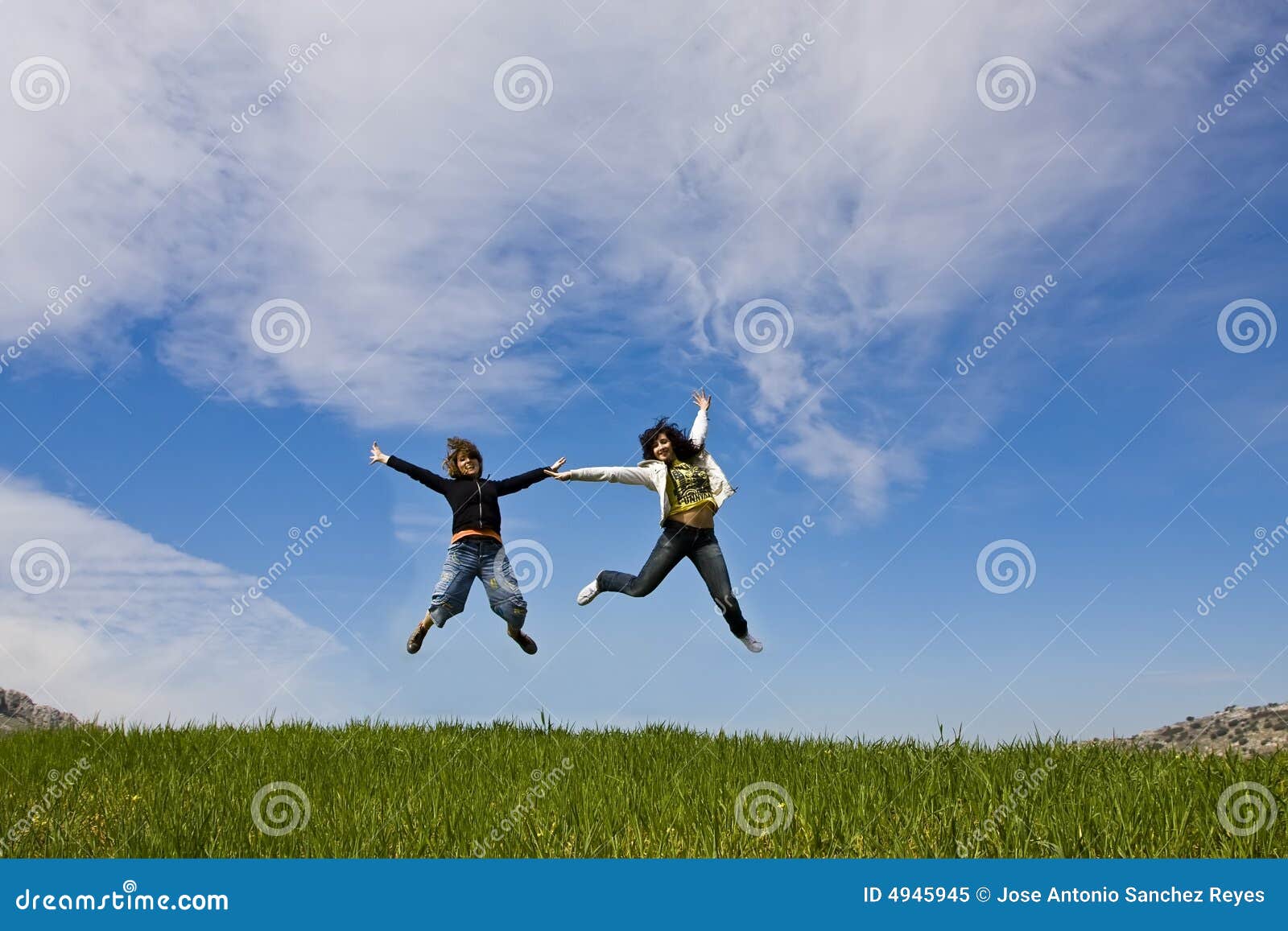 Young friends jumping stock image. Image of blue, grass - 4945945
